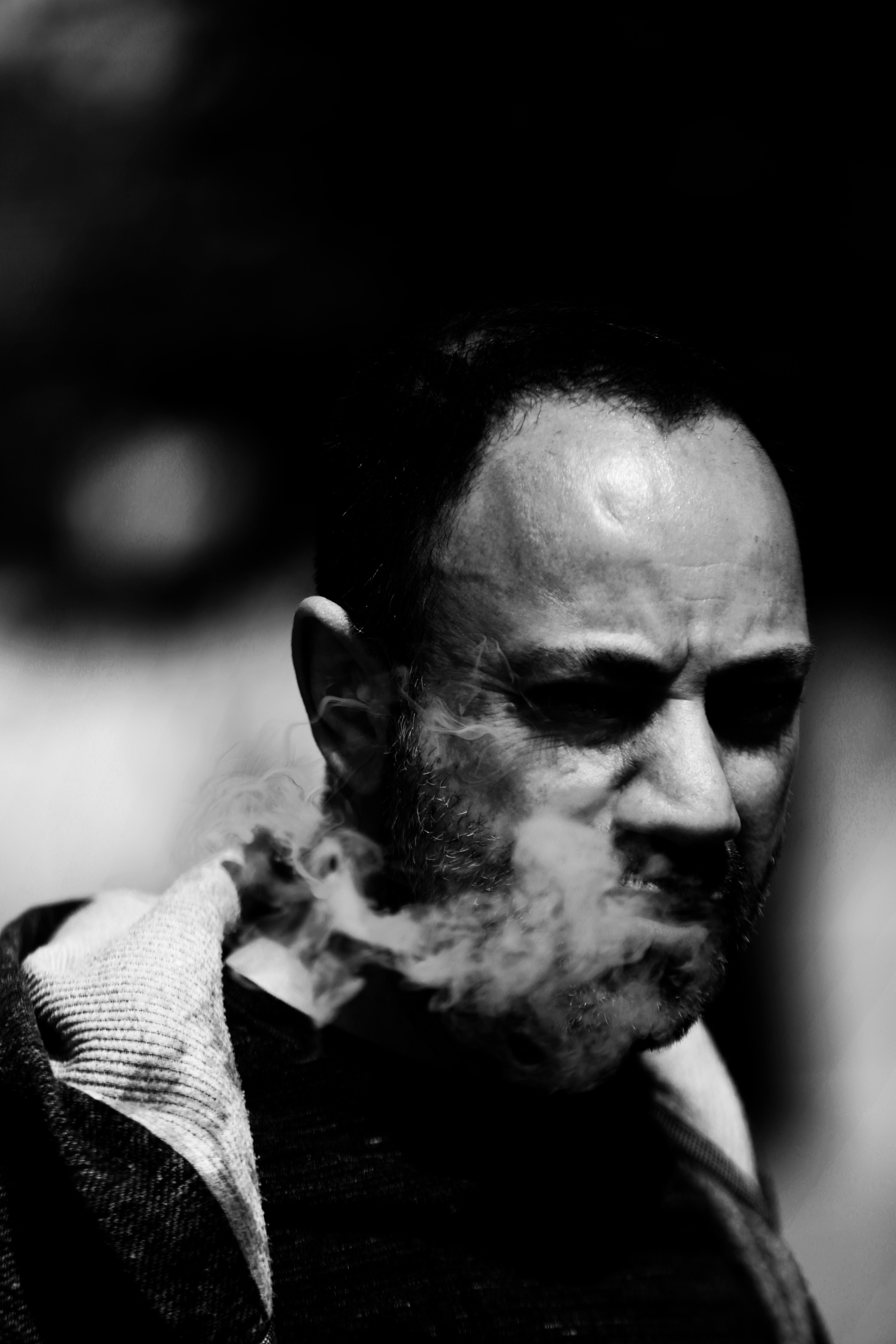Man Exhaling Smoke · Free Stock Photo