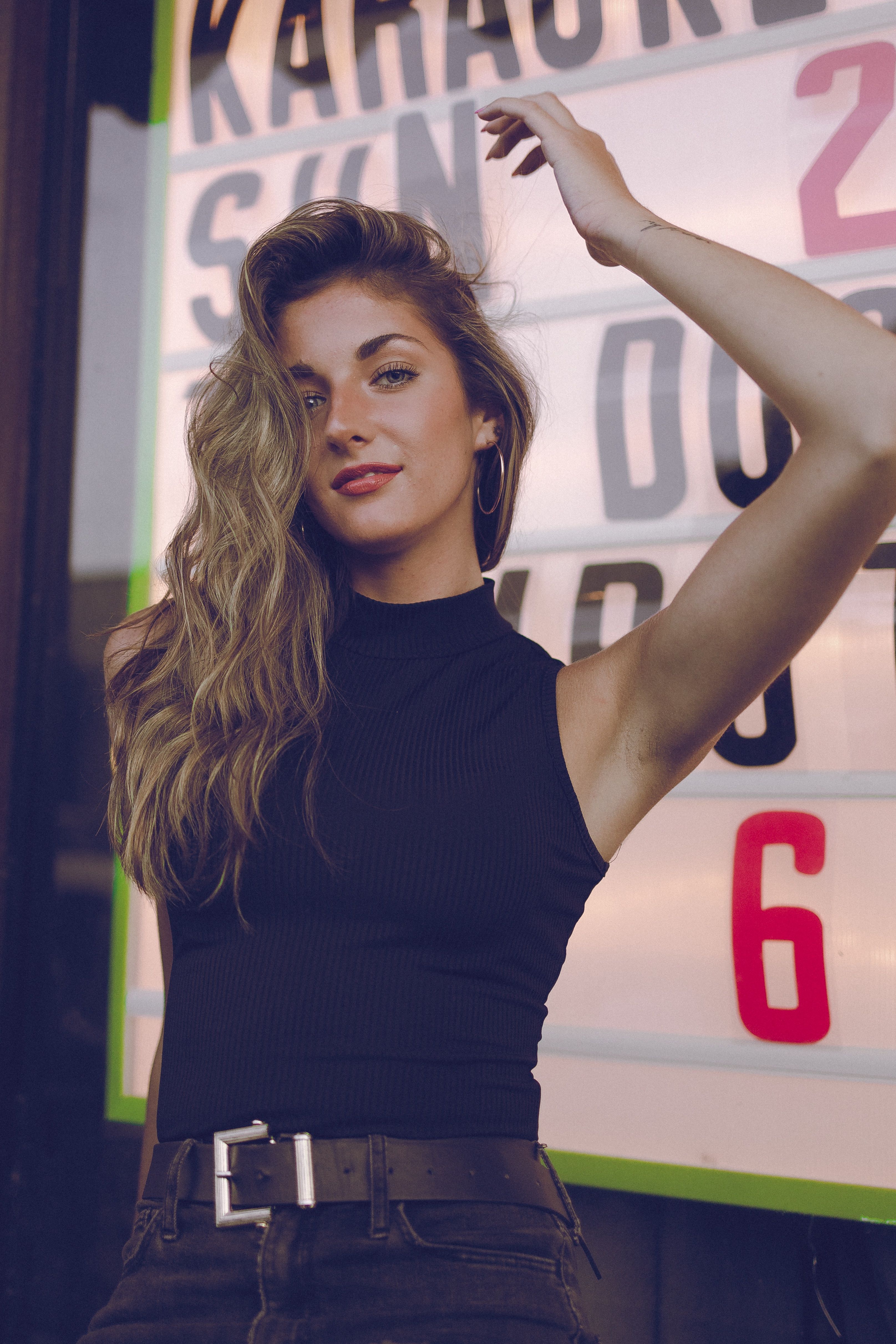 Blonde Woman in Bra Standing with Arms Raised · Free Stock Photo