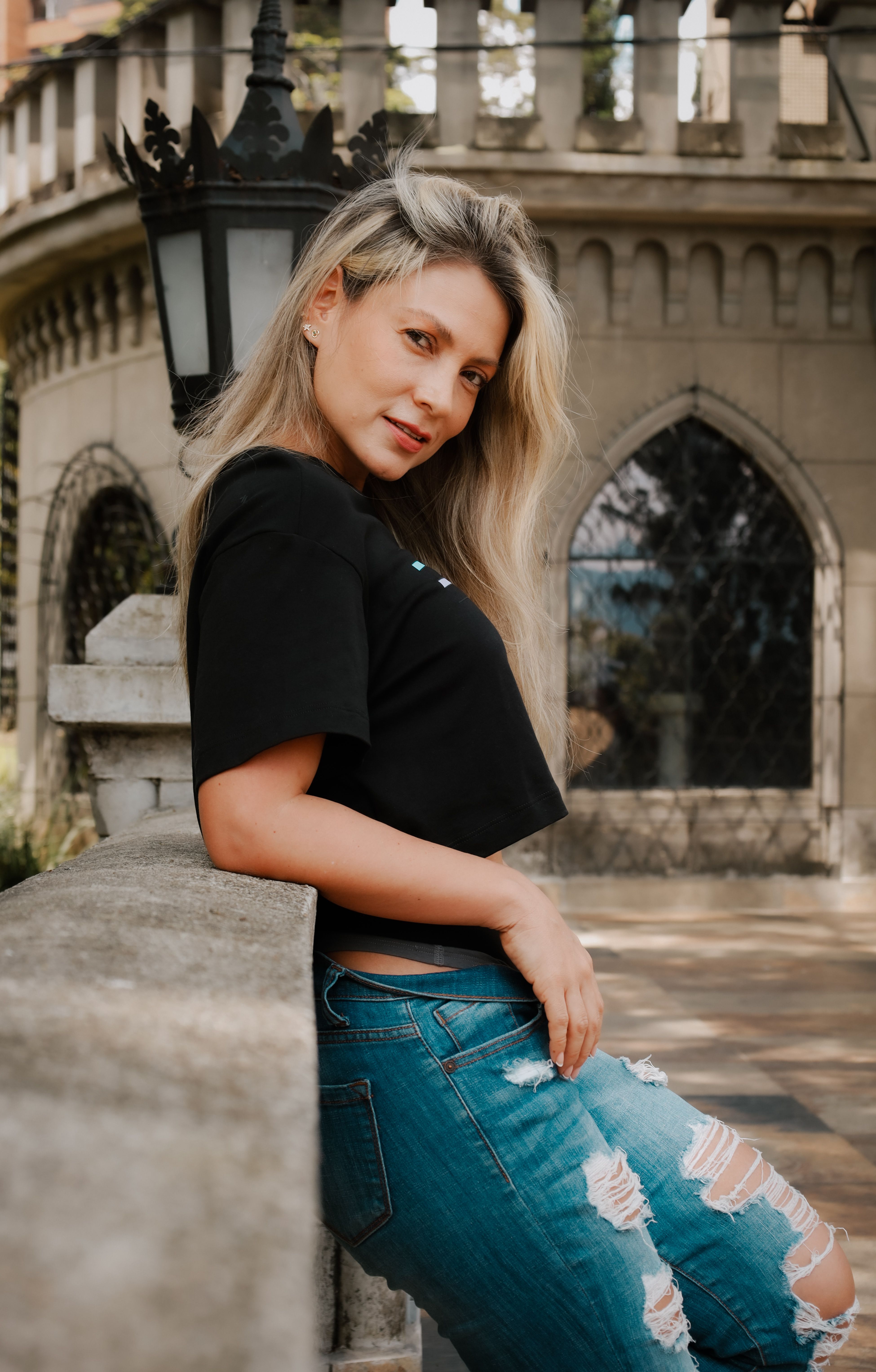 Woman Posing by Wall · Free Stock Photo