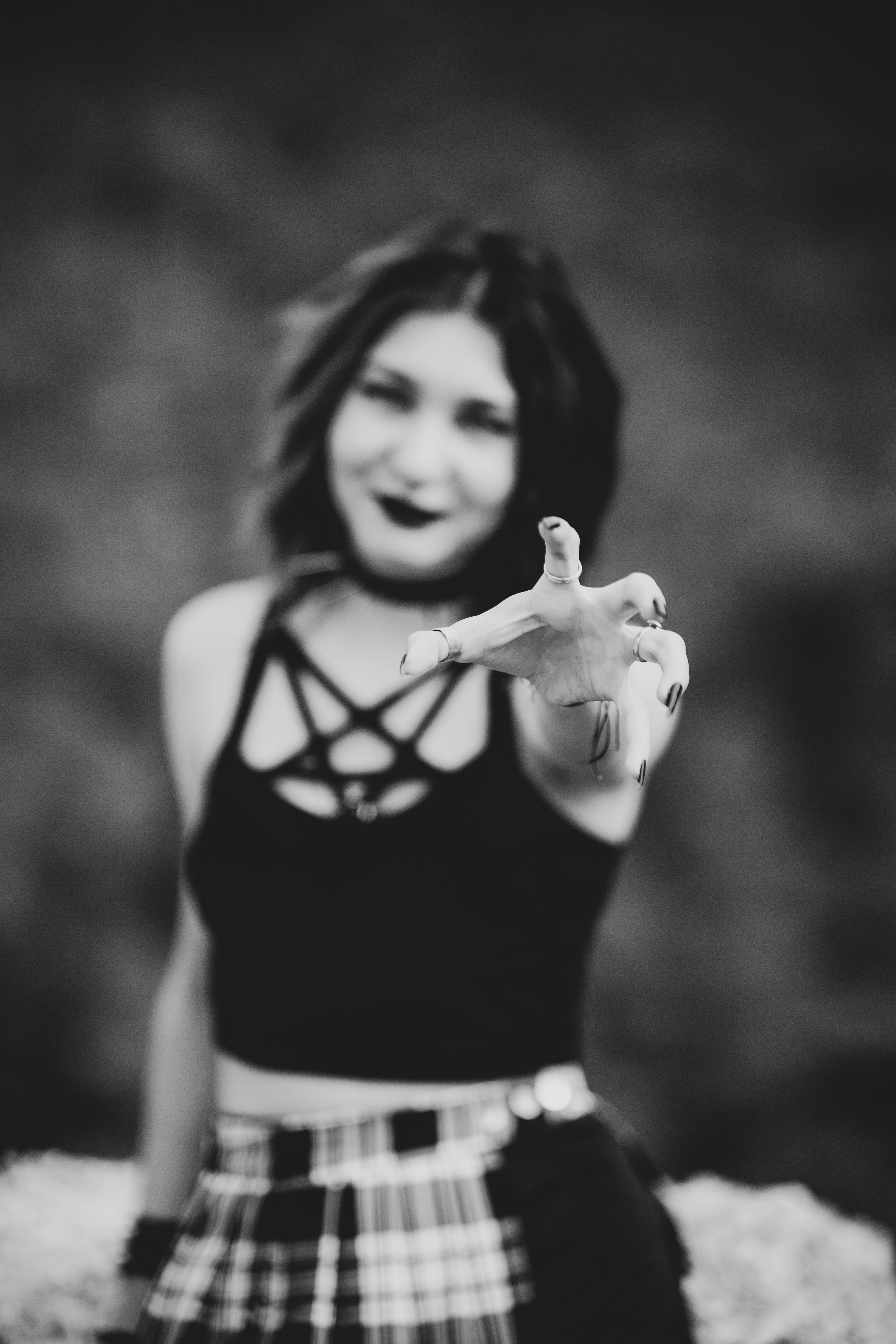 Young Woman in Black Top Trying to Grab Something · Free Stock Photo