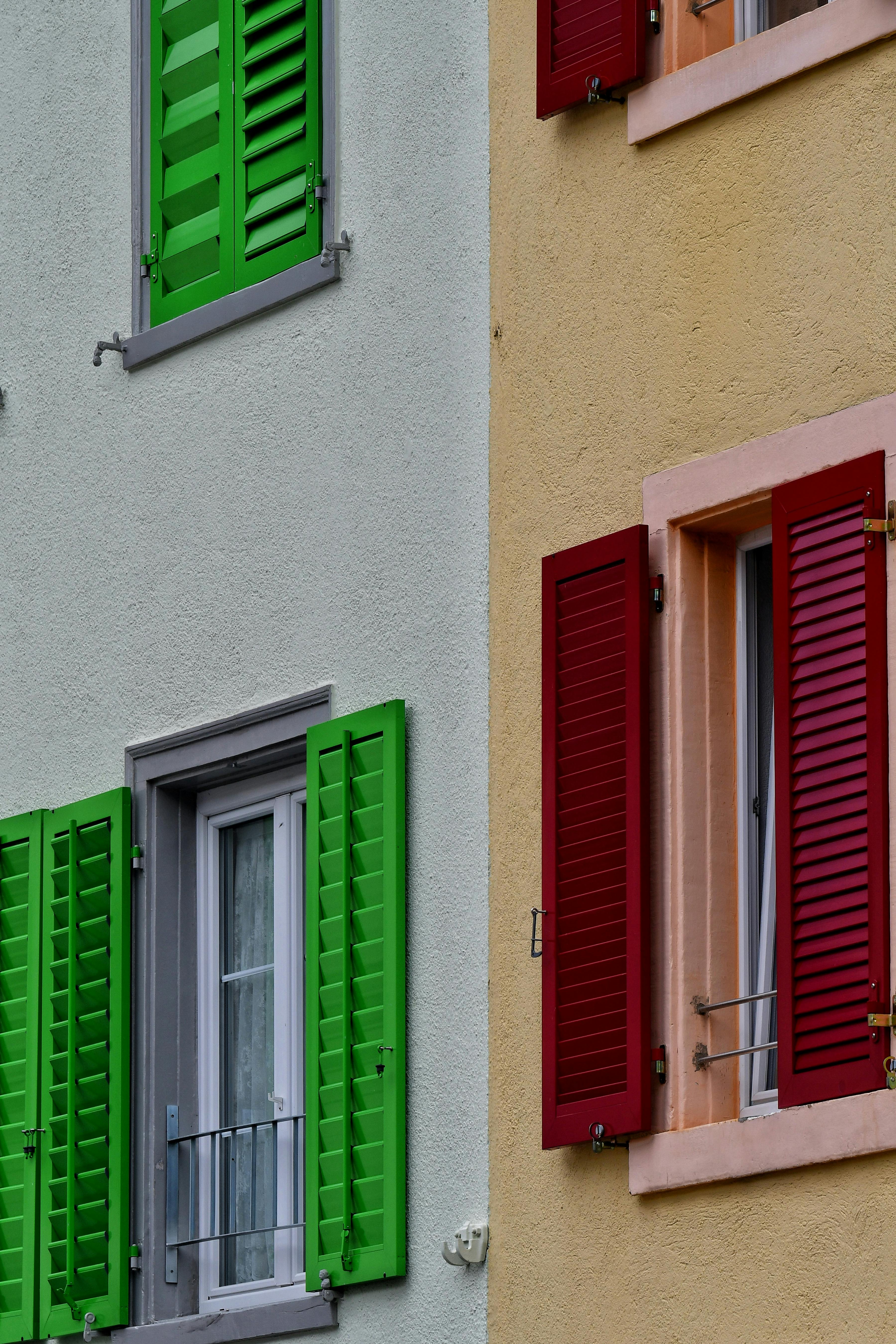 Exterior of a Residential Building with Wooden Shutters · Free Stock Photo