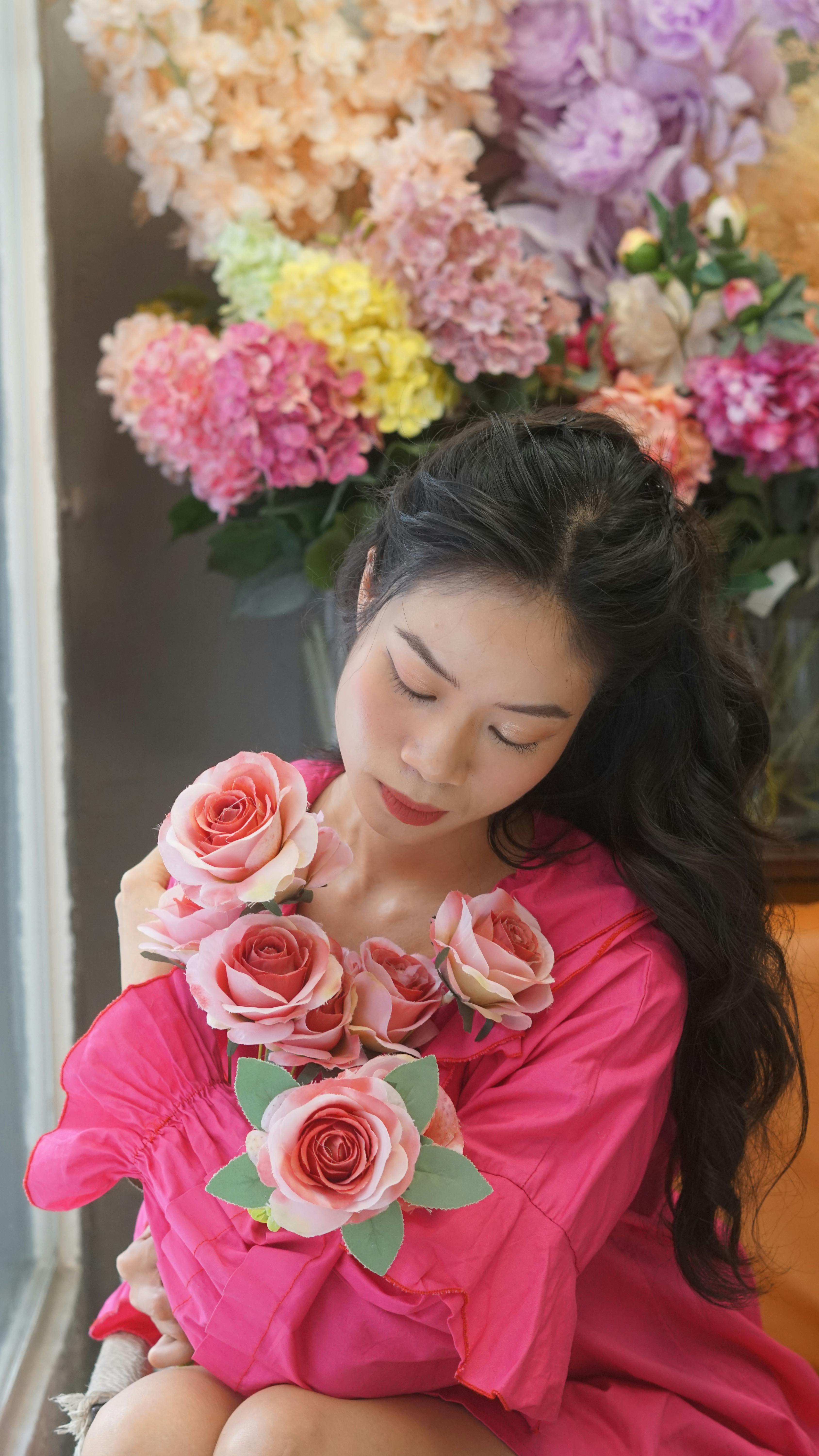 Woman Embracing Bunch of Roses · Free Stock Photo