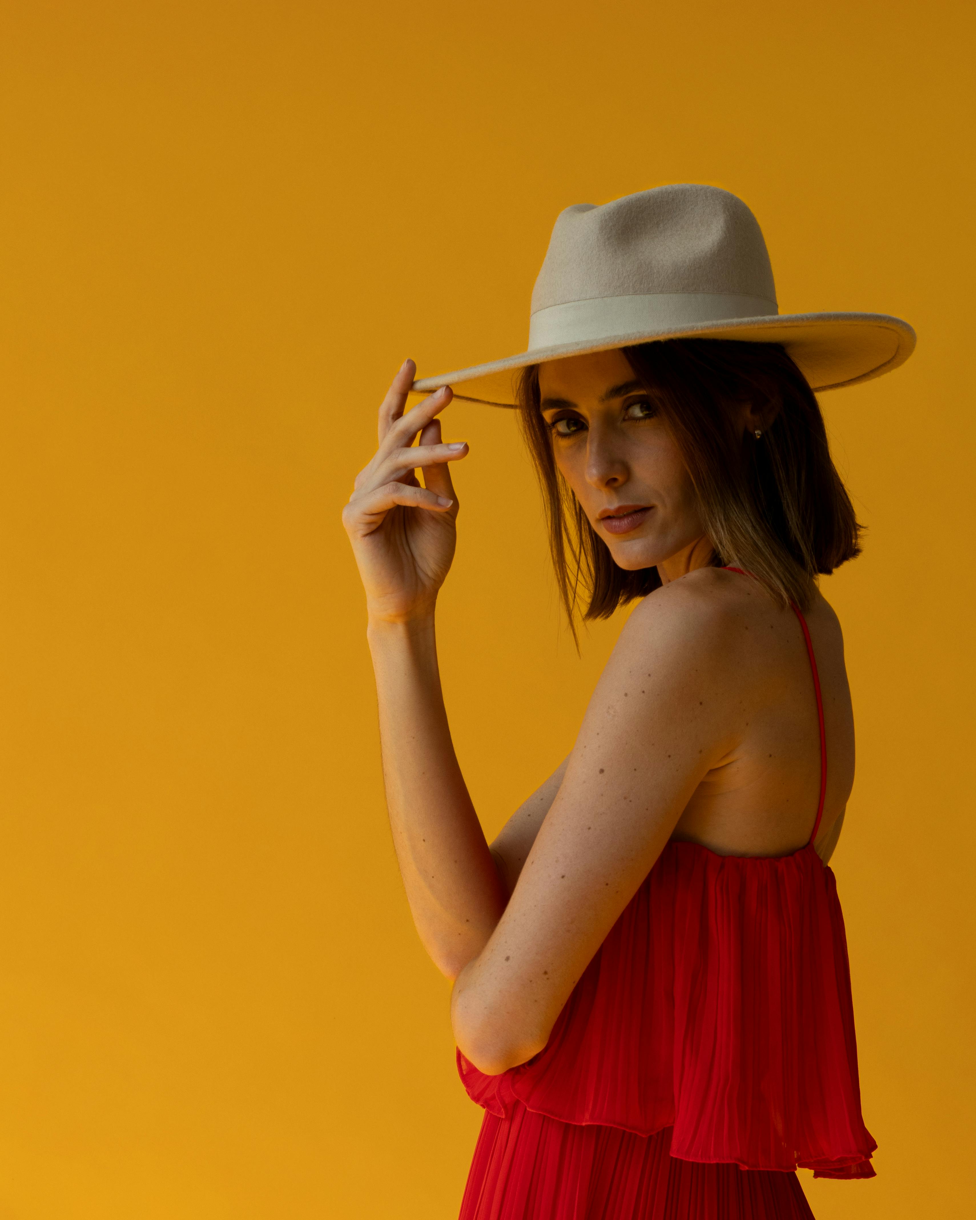 Studio Portrait of a Female Model Wearing a Fedora · Free Stock Photo