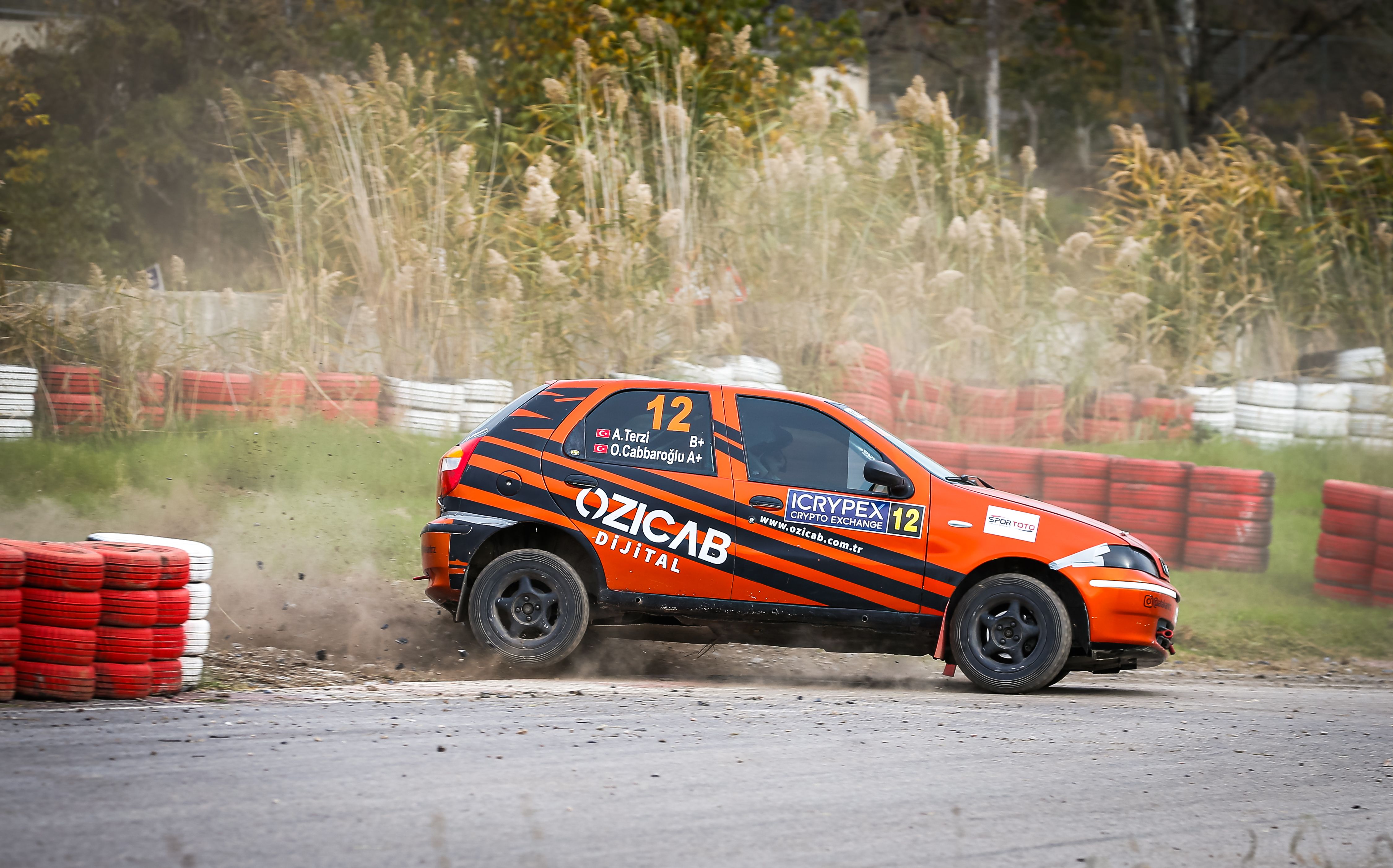 A rally car driving on a track · Free Stock Photo