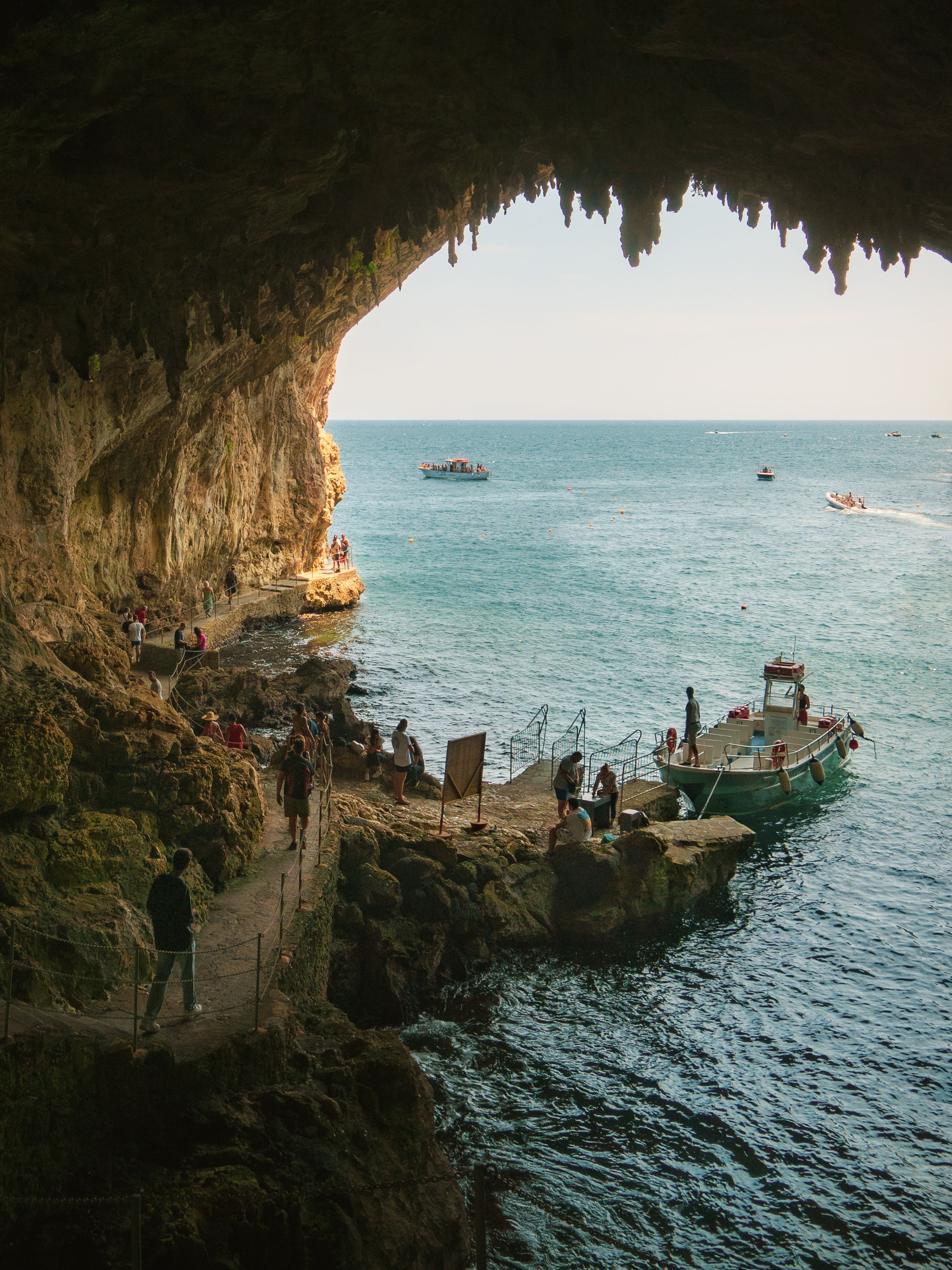 People and Boat in Bay in Cave · Free Stock Photo