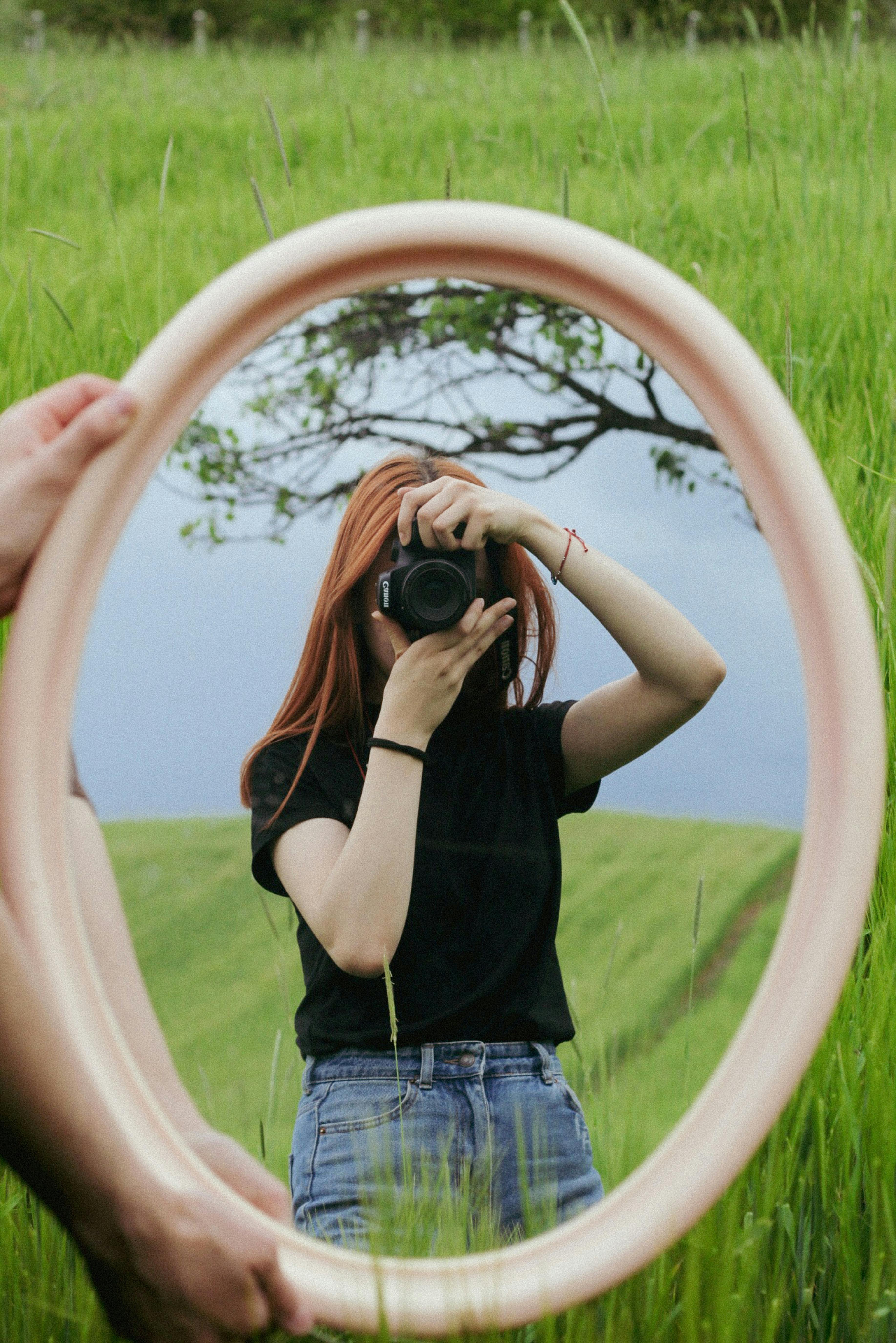 Reflection of Woman Taking Pictures in Mirror · Free Stock Photo