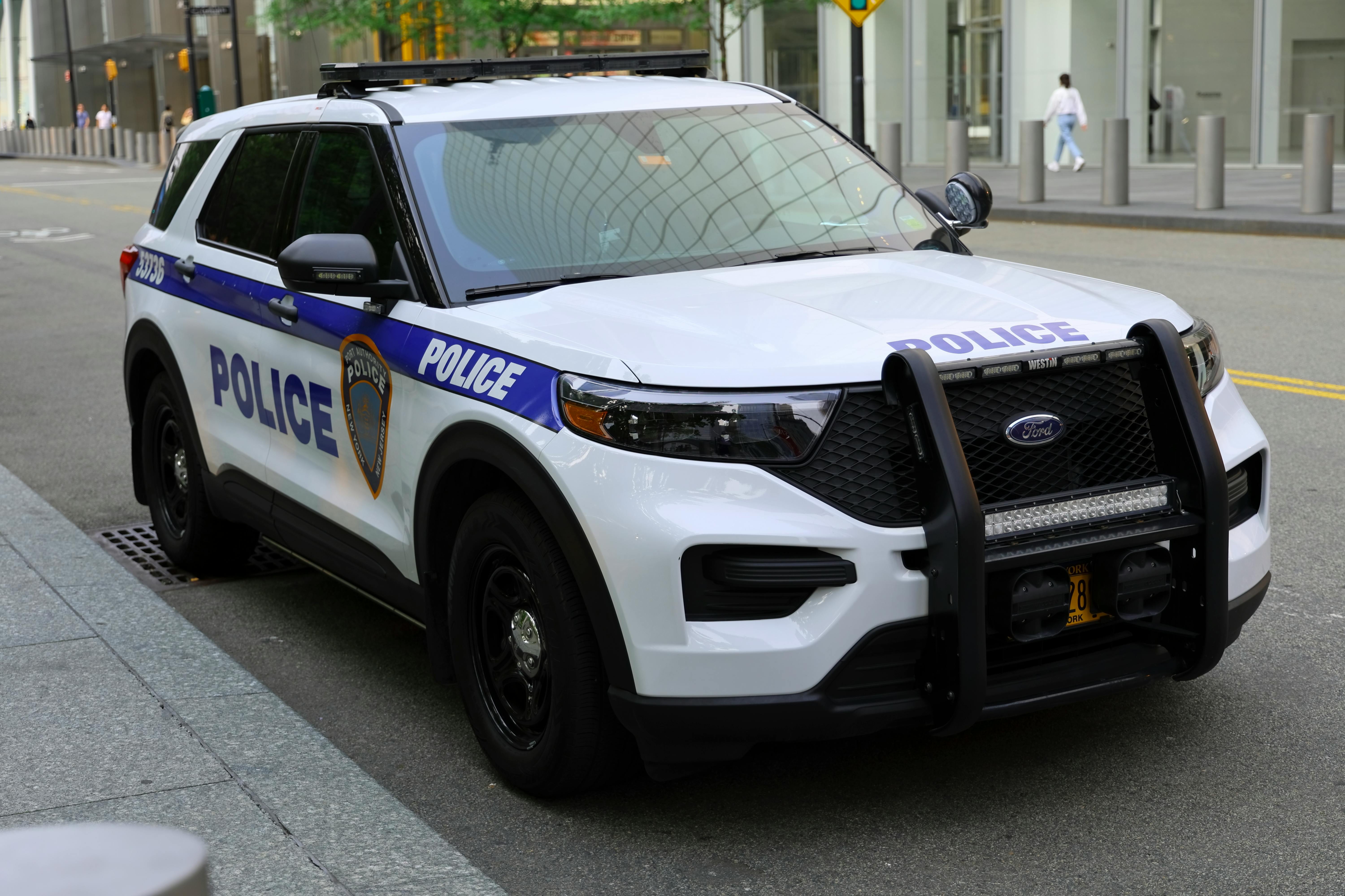 Police Car Parked Near Building · Free Stock Photo