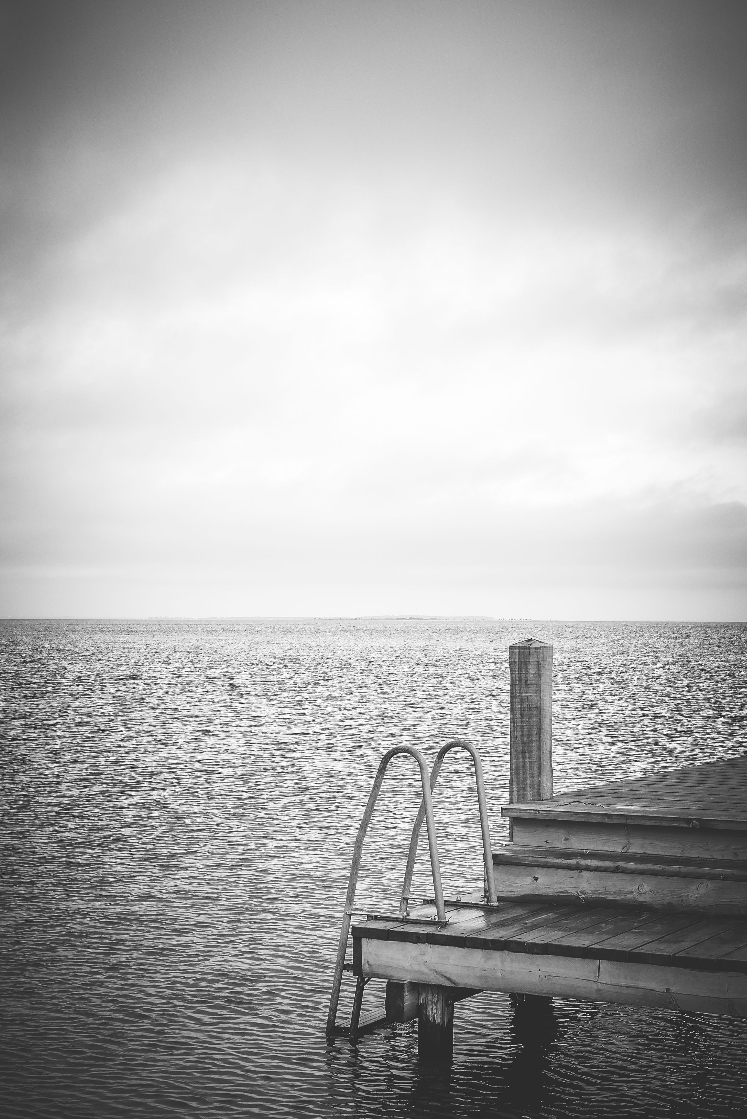 Ladder on Jetty Leading into Sea · Free Stock Photo