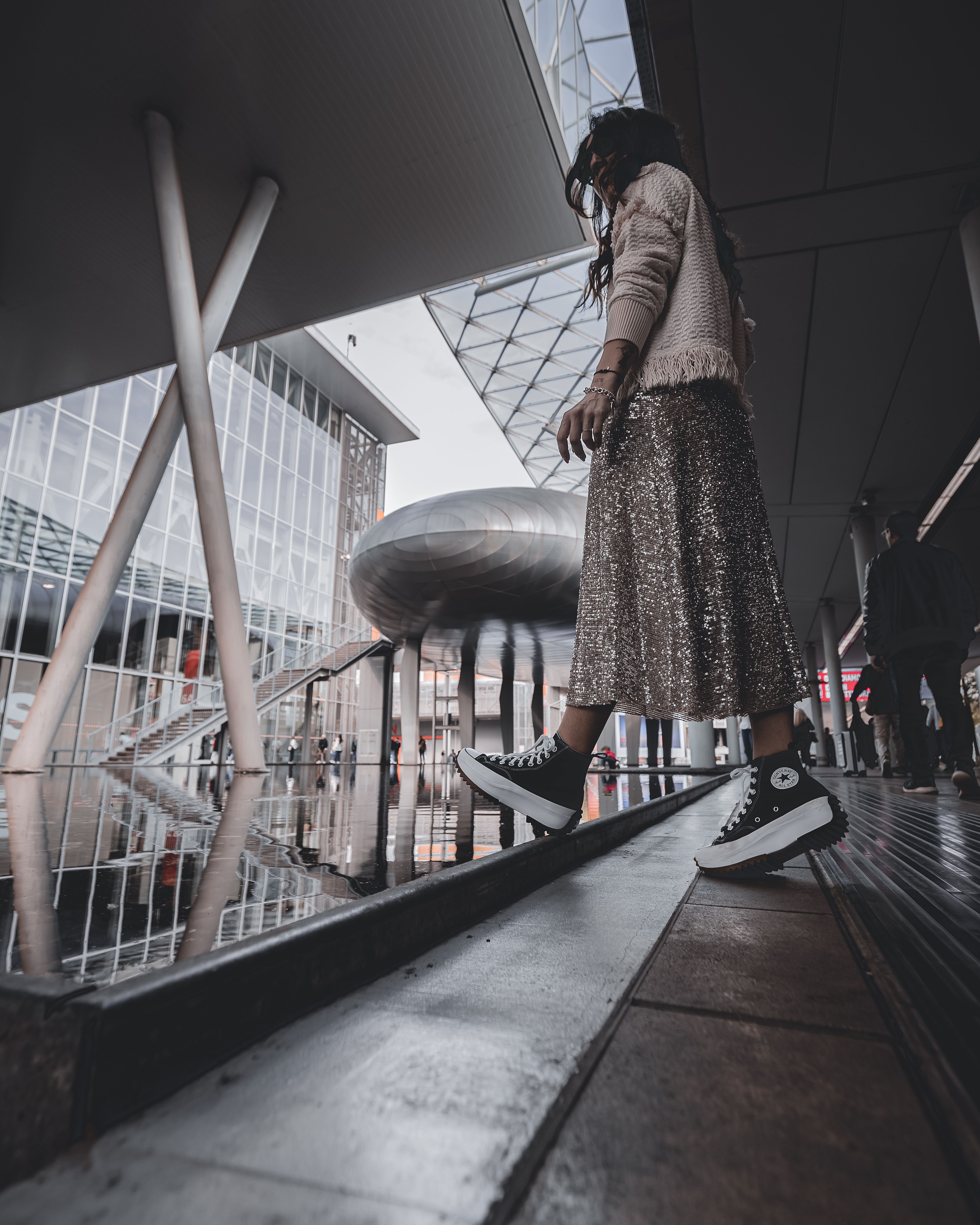 Woman Standing in a Modern Building · Free Stock Photo