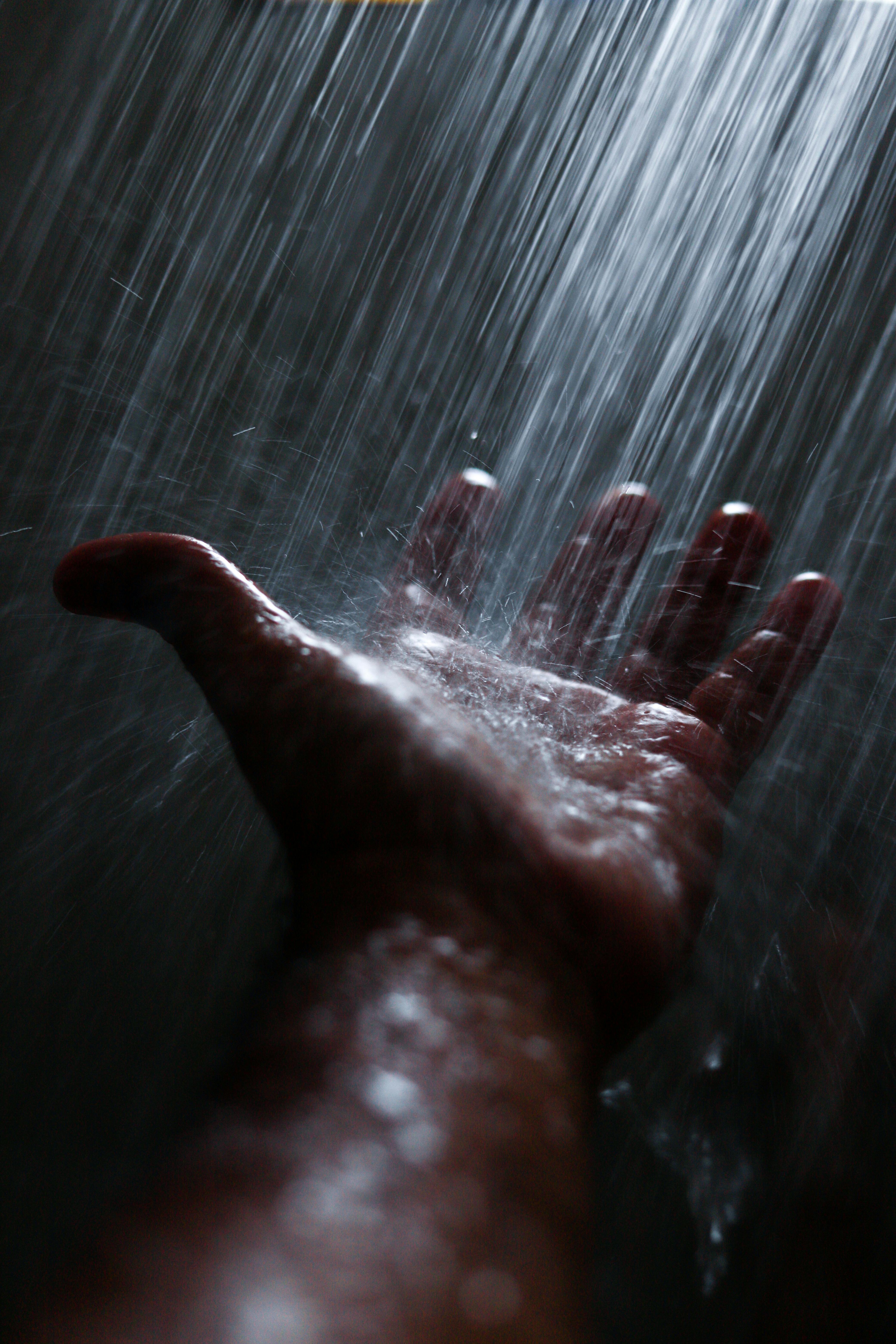 Person's Left Hand Catching Water · Free Stock Photo