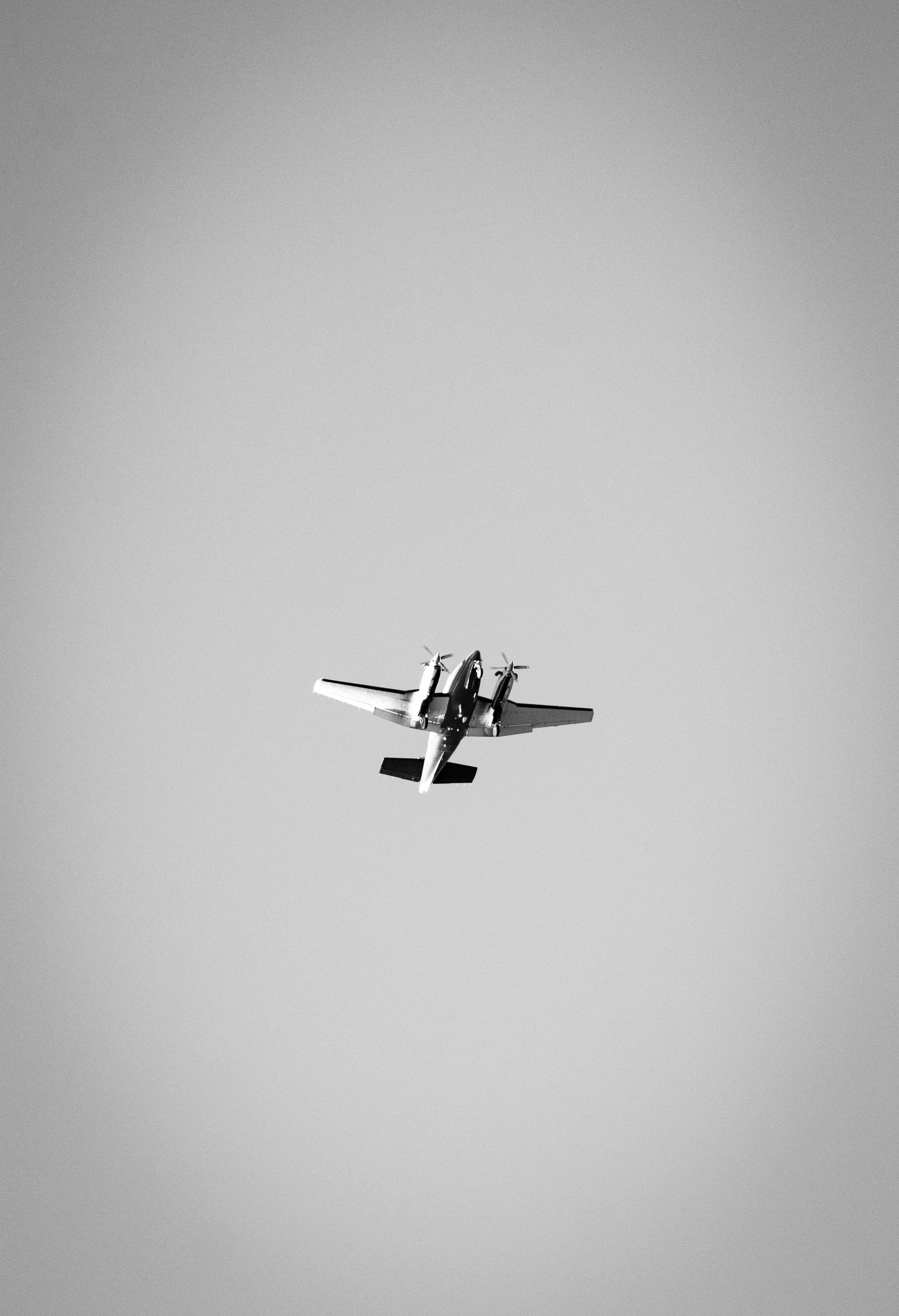 A small airplane flying in the sky · Free Stock Photo