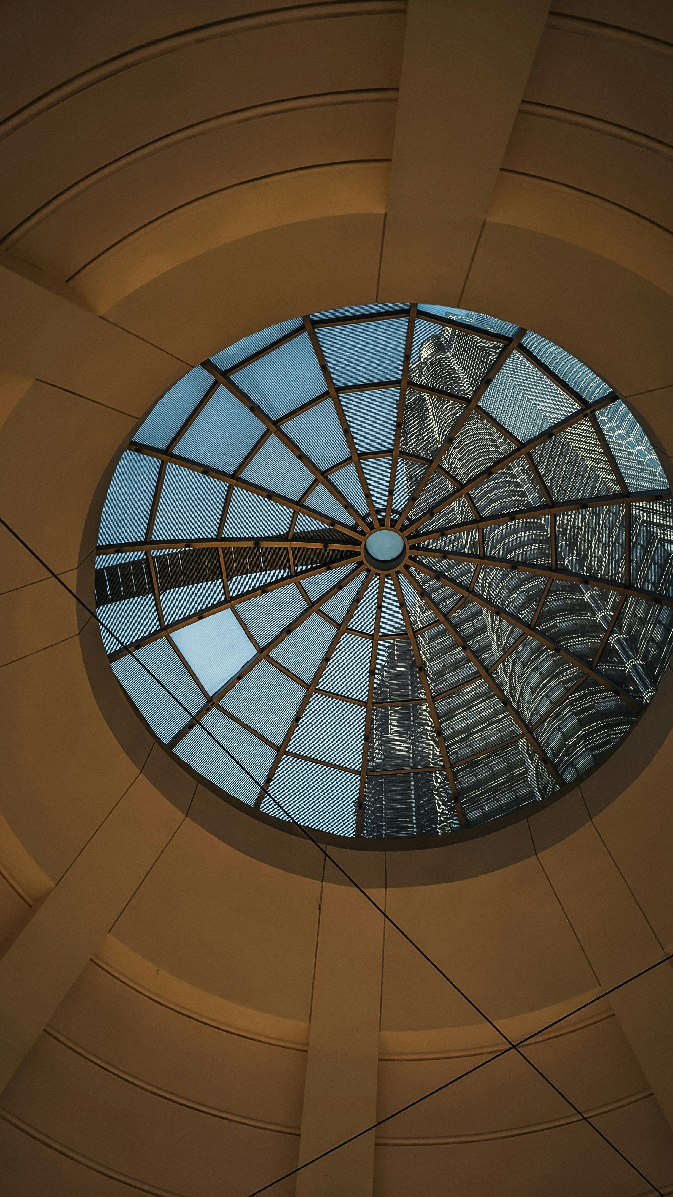 Skyscraper Seen through Glass Ceiling · Free Stock Photo
