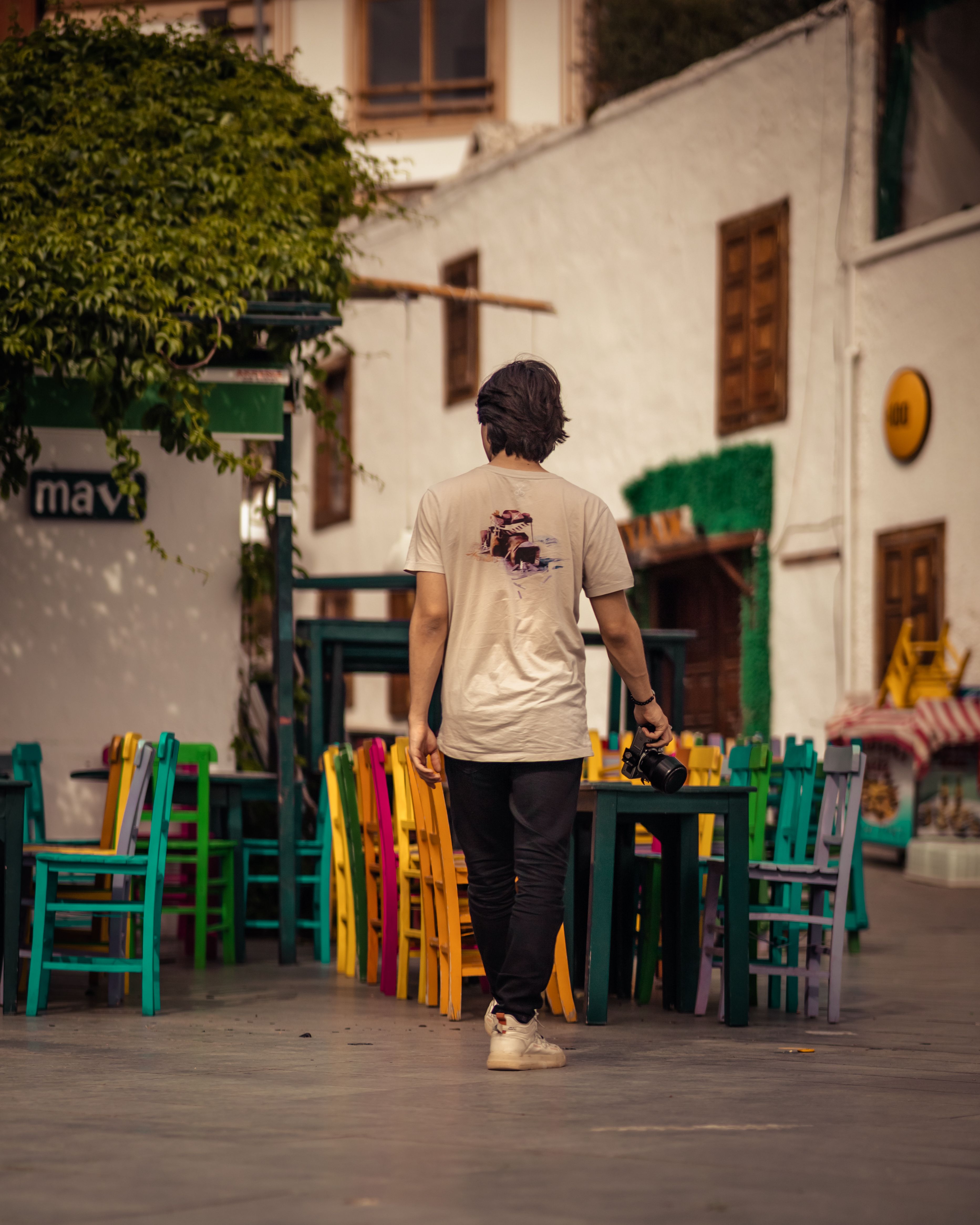 Man Walking with a Camera · Free Stock Photo