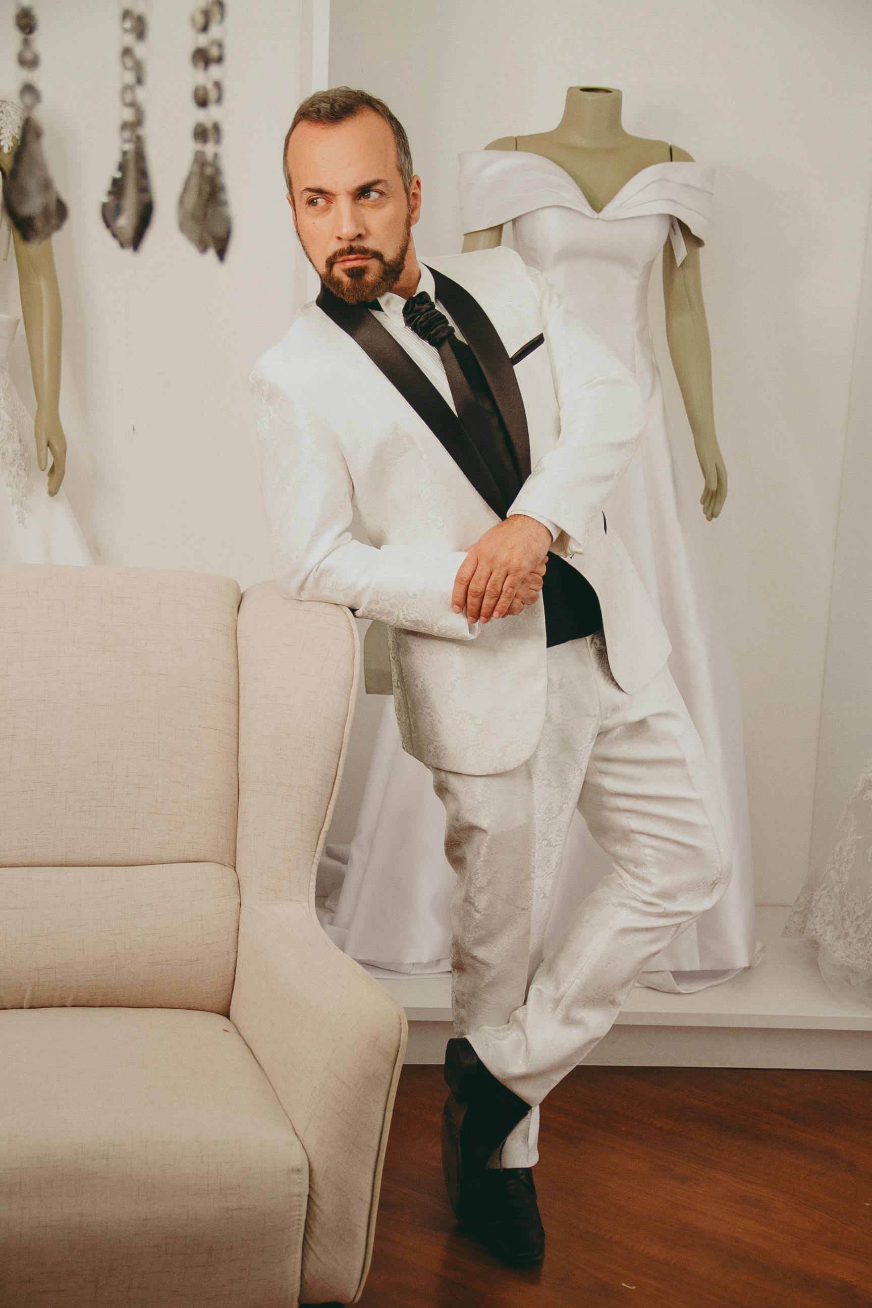 Man Posing in White Suit · Free Stock Photo