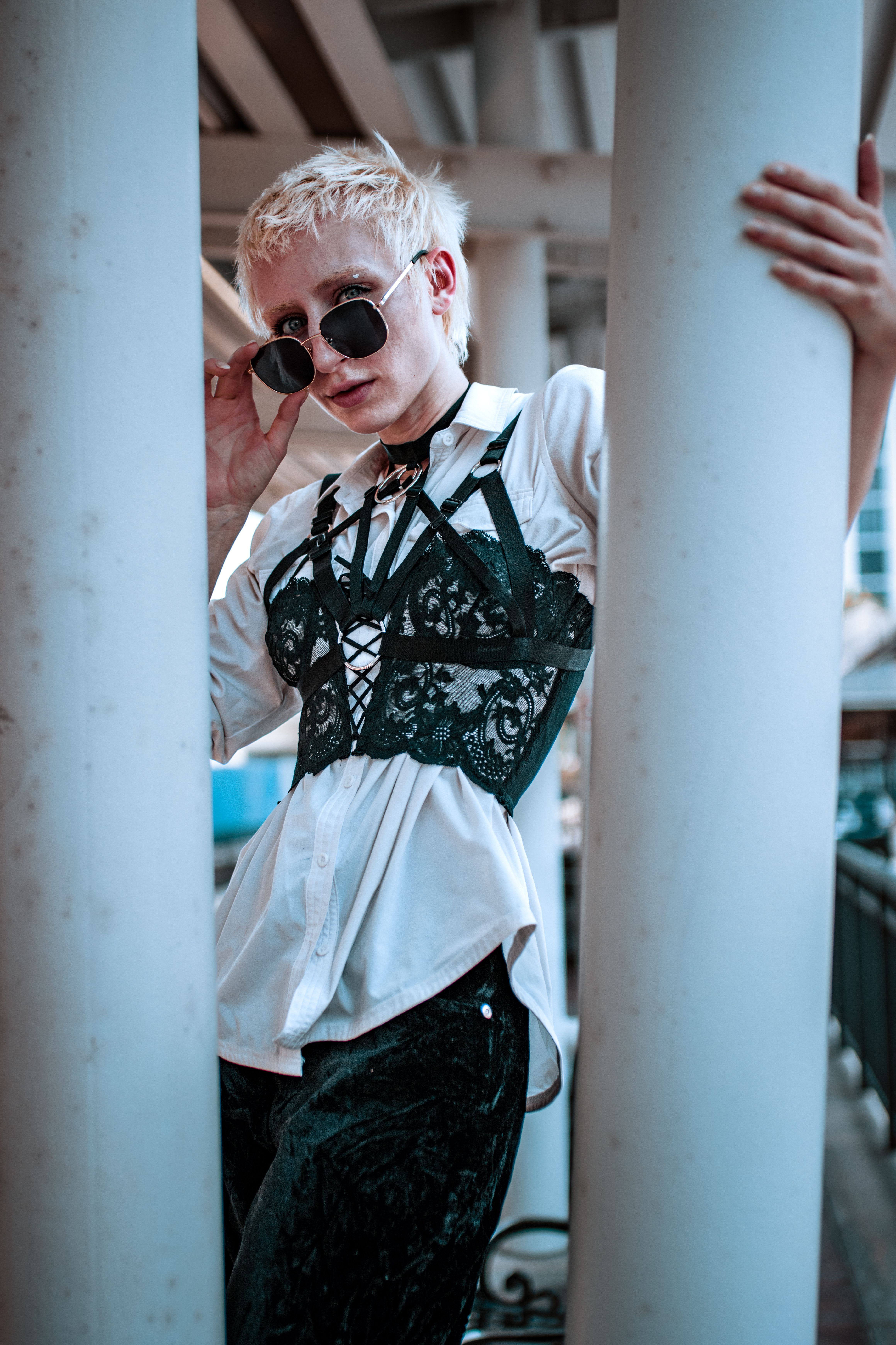 Woman Posing between Two Metal Posts · Free Stock Photo