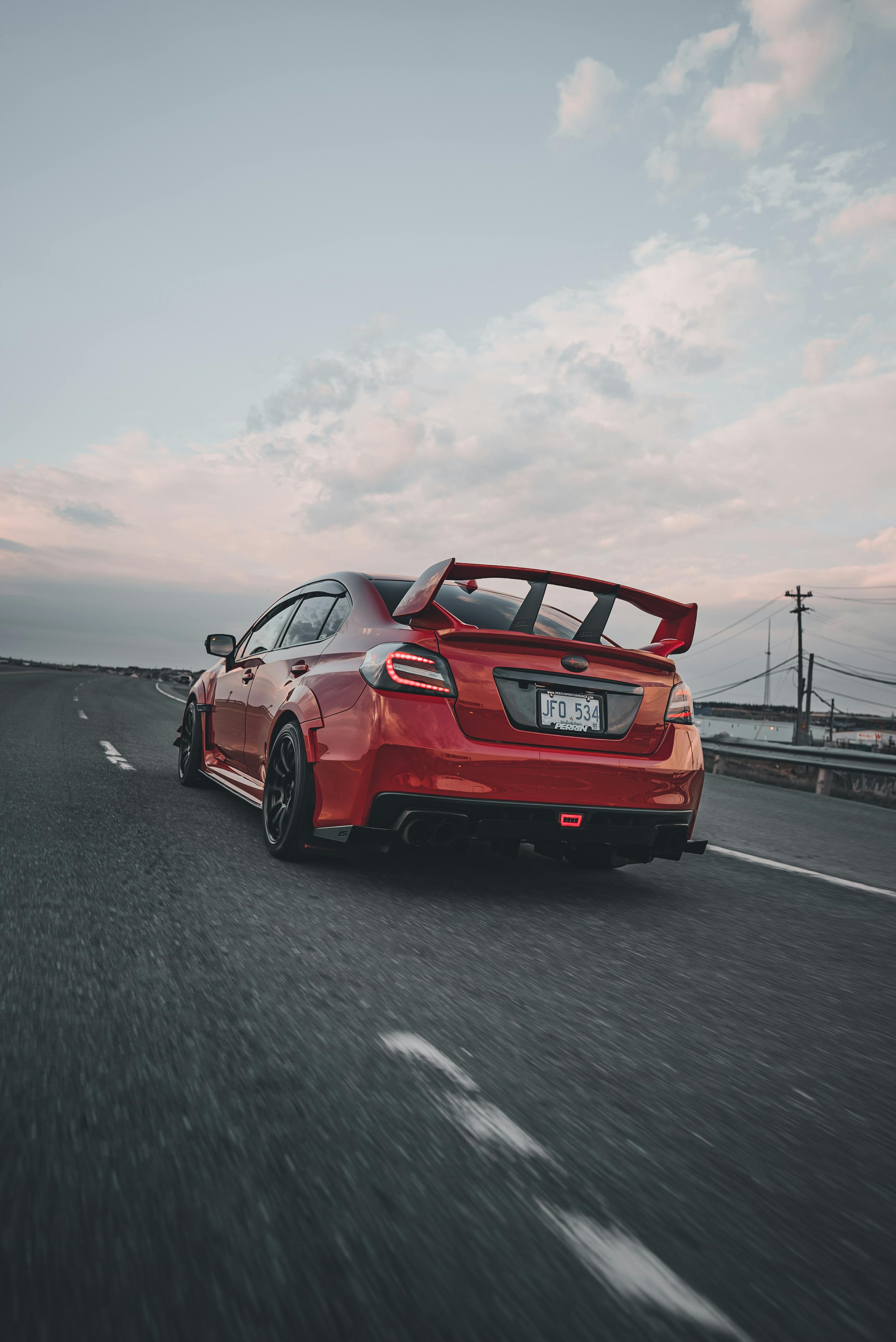 Tail of Running on Road Red Subaru Impreza WRX · Free Stock Photo