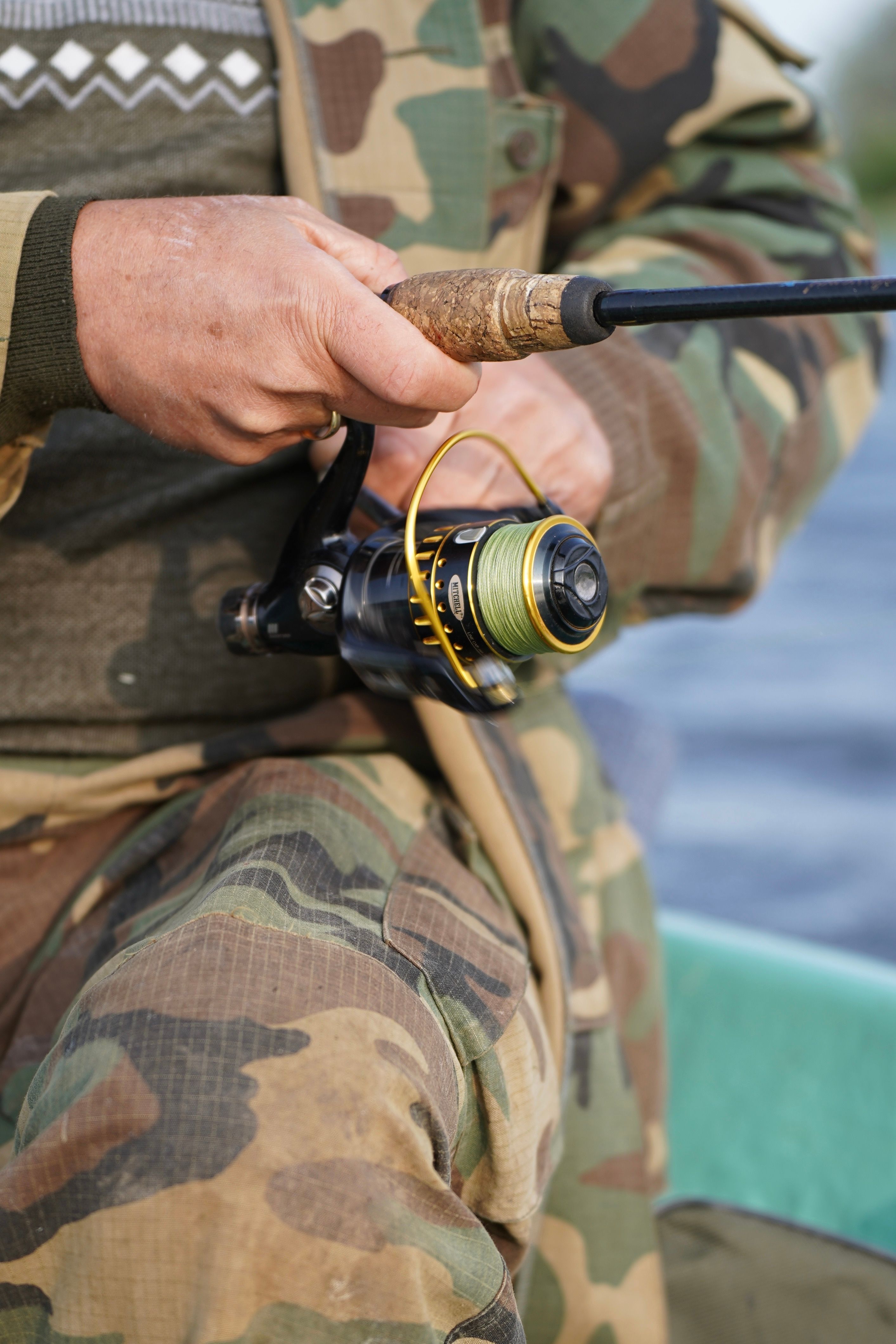 Angler Holding Fishing Rod · Free Stock Photo