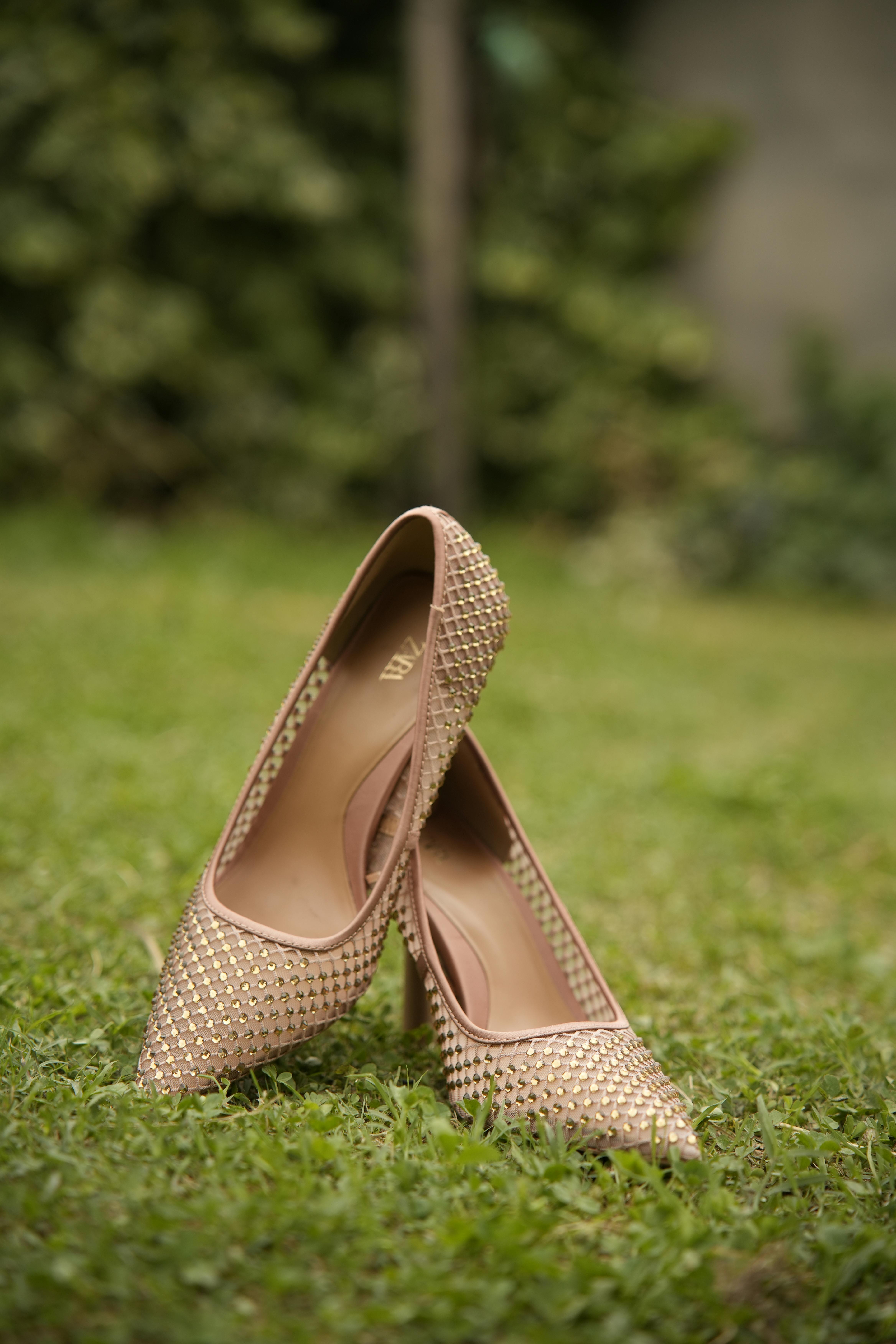 Display High Heels on Grass · Free Stock Photo