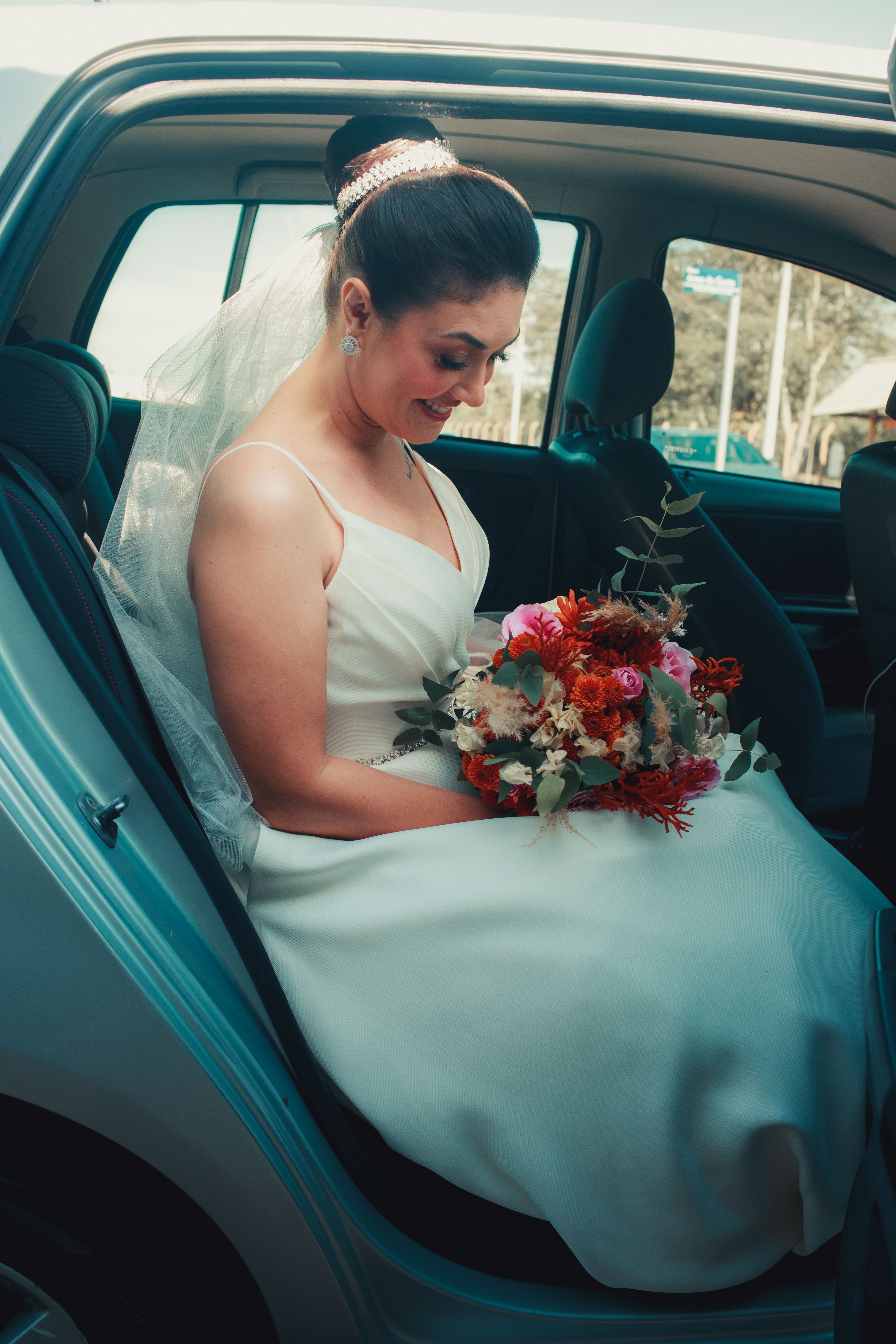 Bride with Bouquet Sitting in Car · Free Stock Photo