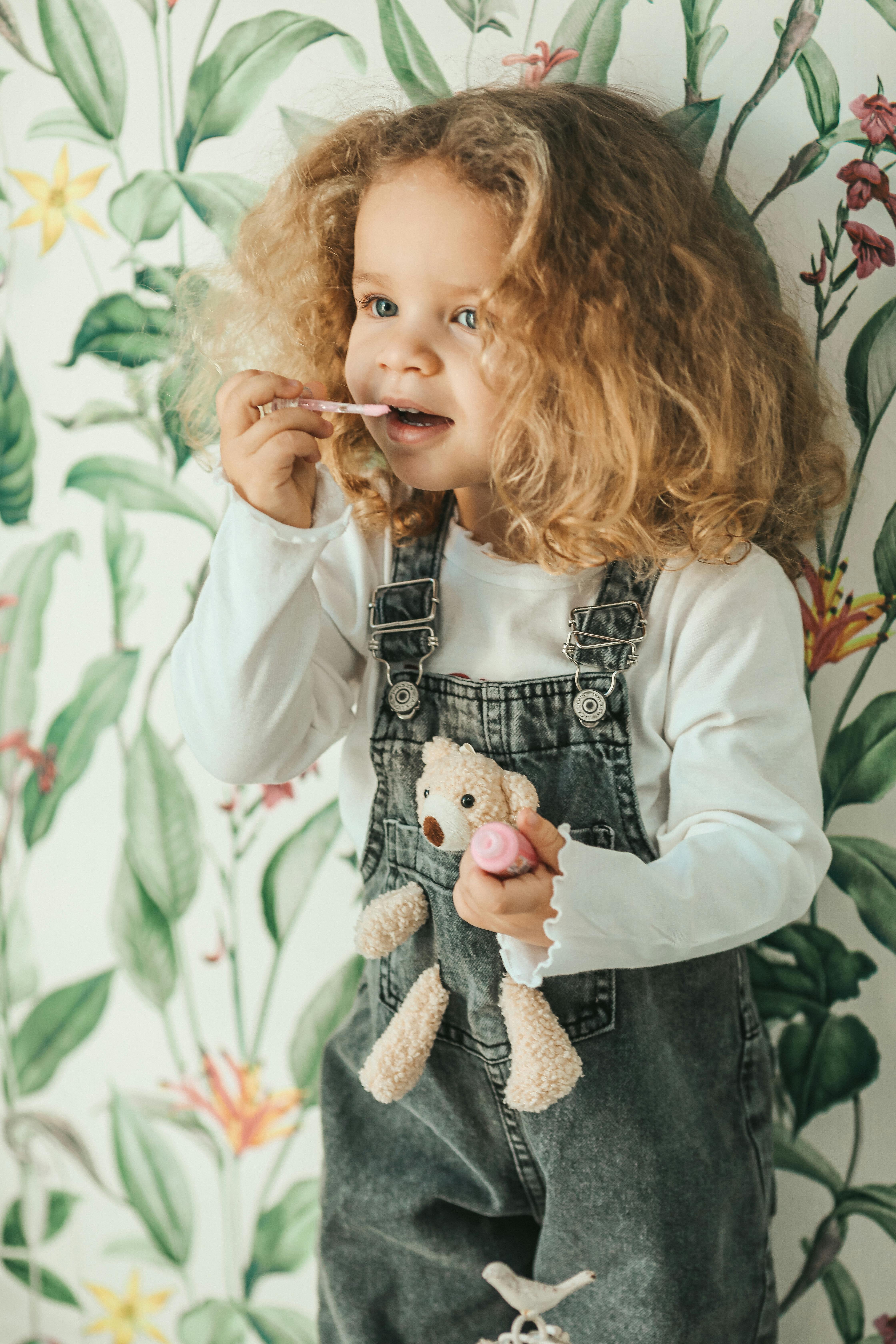 Little Girl with Pink Stick in Hand · Free Stock Photo