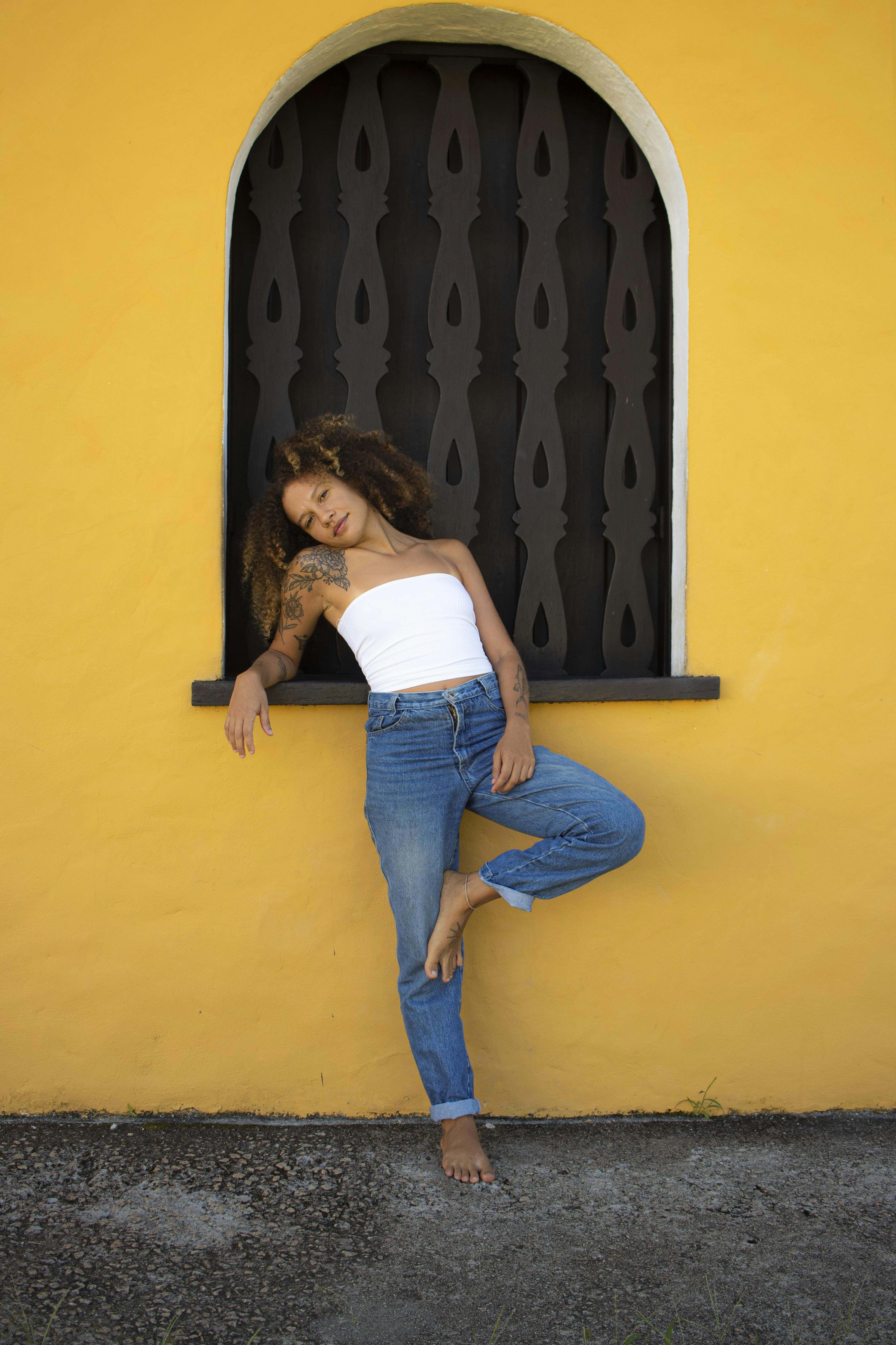 Barefoot Woman with Tattoos Posing in Shirt and with Cup · Free Stock Photo
