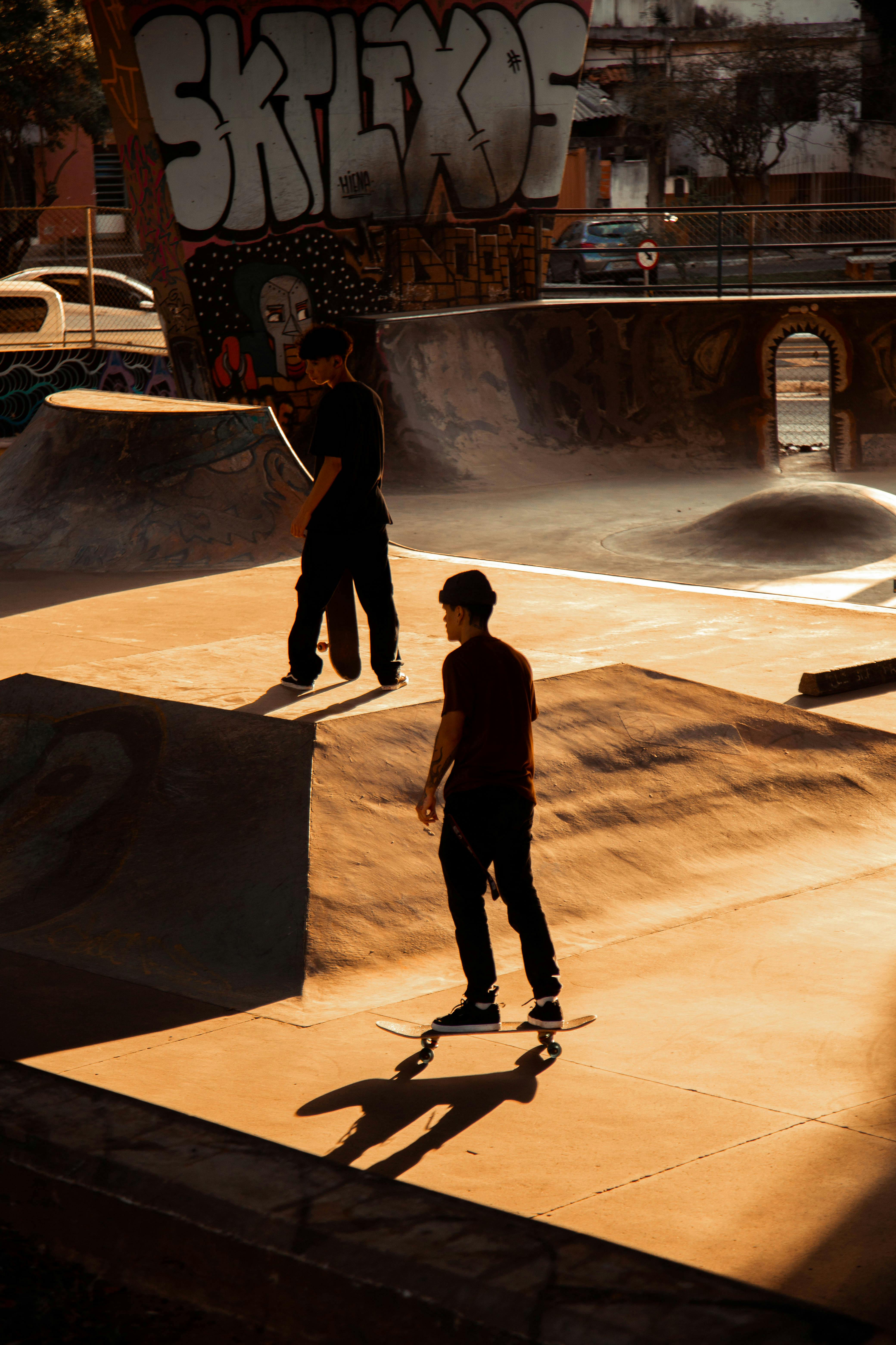 Group of Friends Having Fun Standing on Skate Park · Free Stock Photo