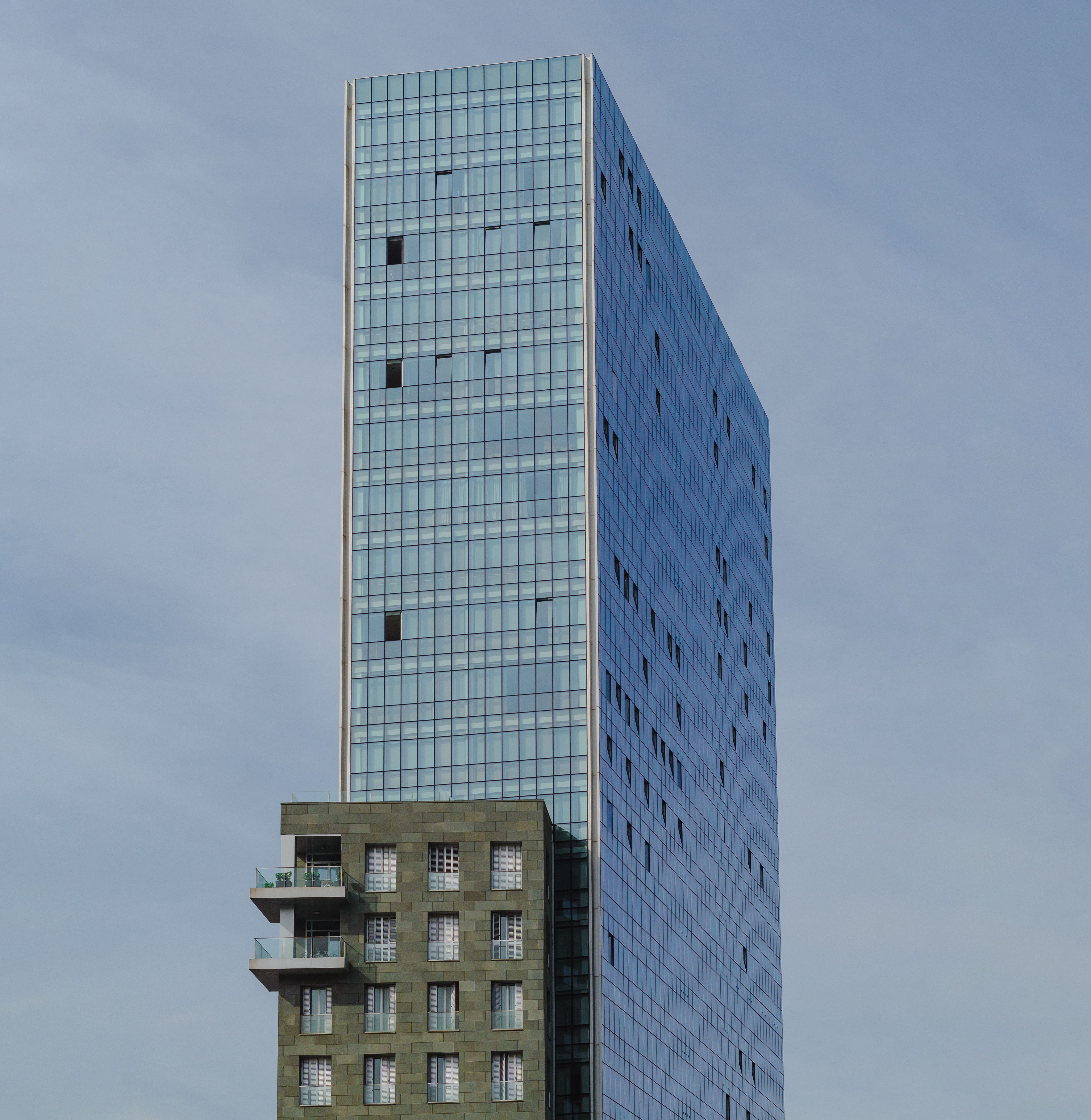 Glass Skyscraper Built into Old Block of Flats · Free Stock Photo