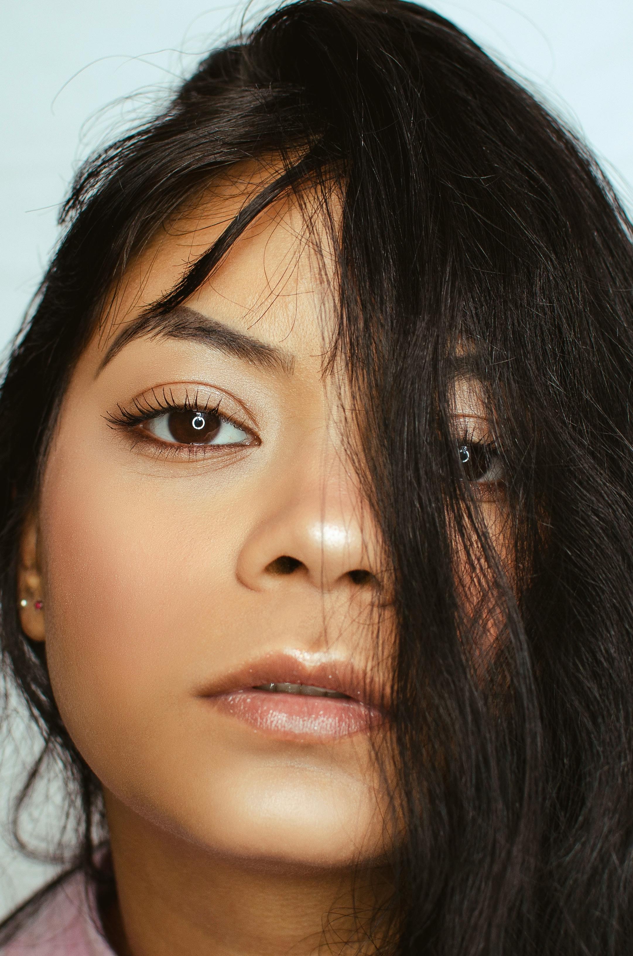 Beautiful Girl with Hair over Her Face · Free Stock Photo