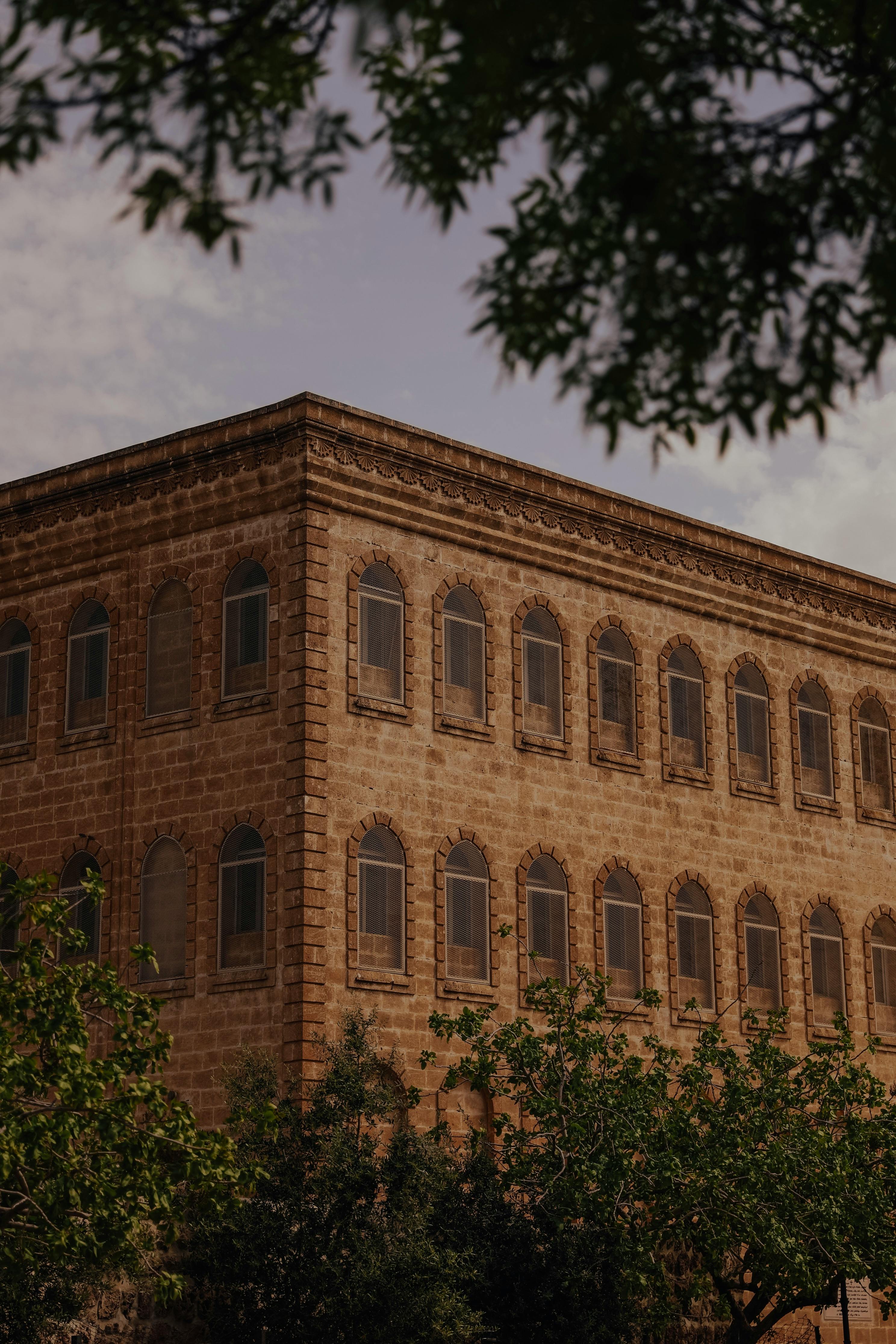 Corner of Building with Arches and Columns · Free Stock Photo