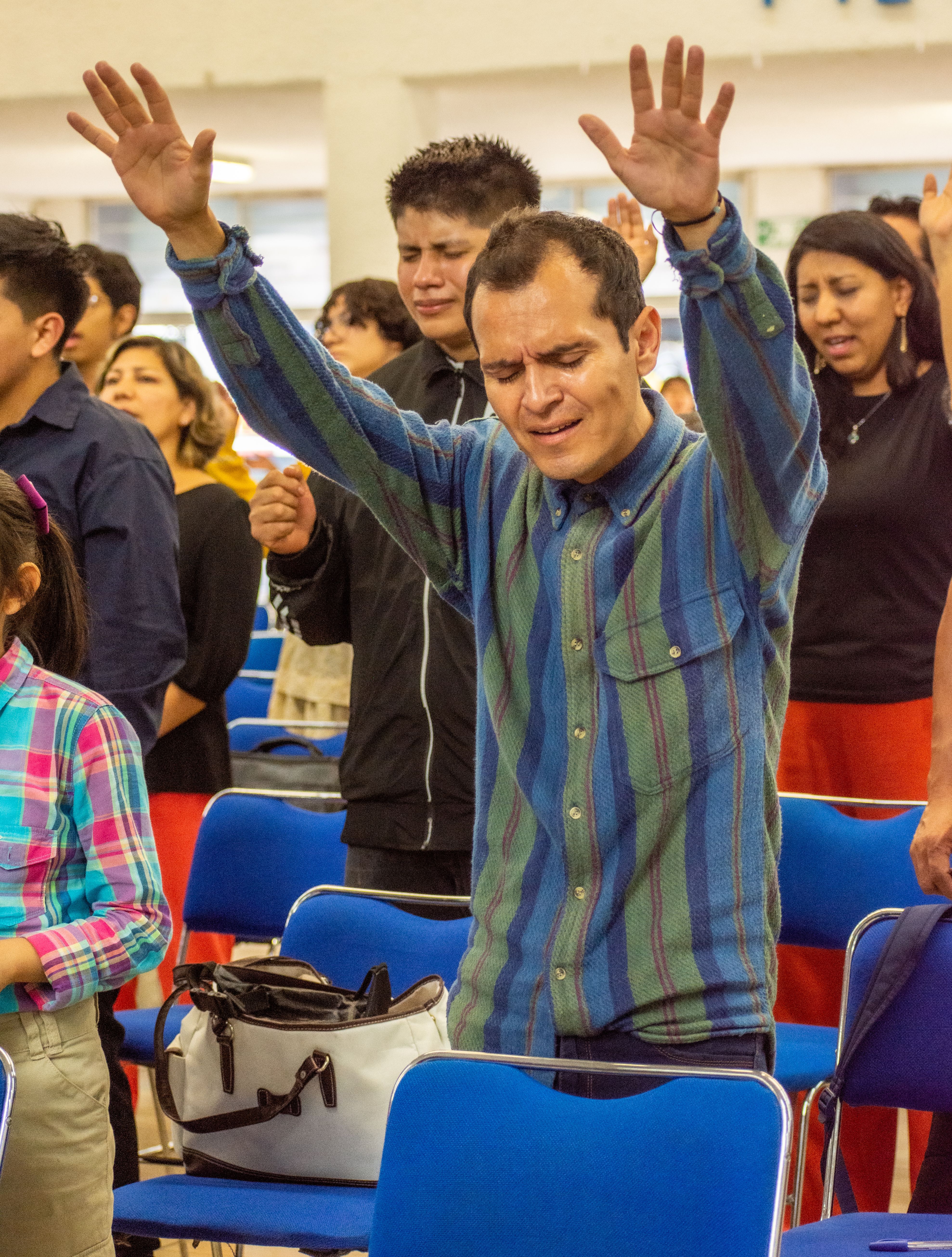 People Praying with Arms Raised · Free Stock Photo