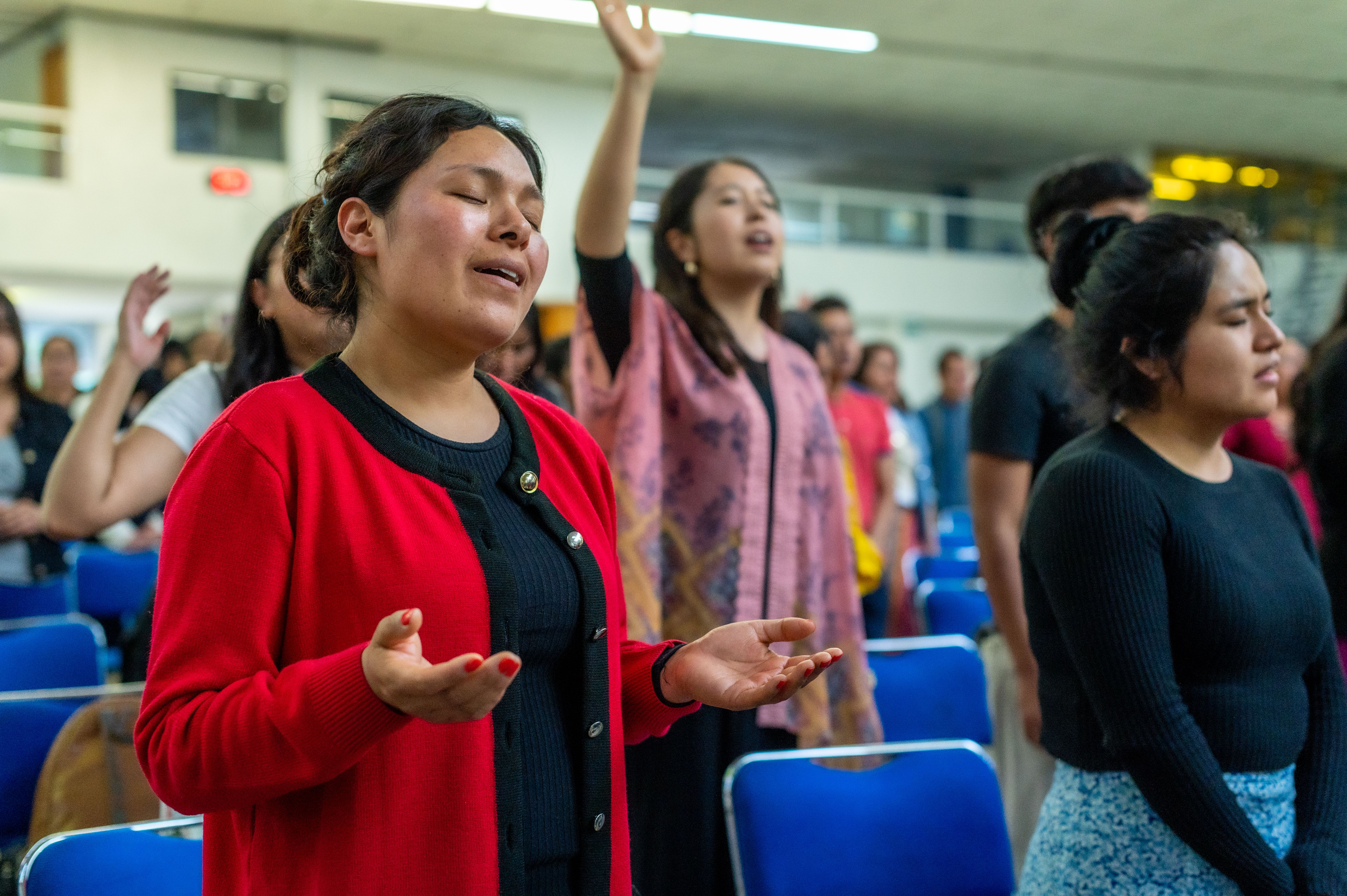 A group of women are singing in a church · Free Stock Photo