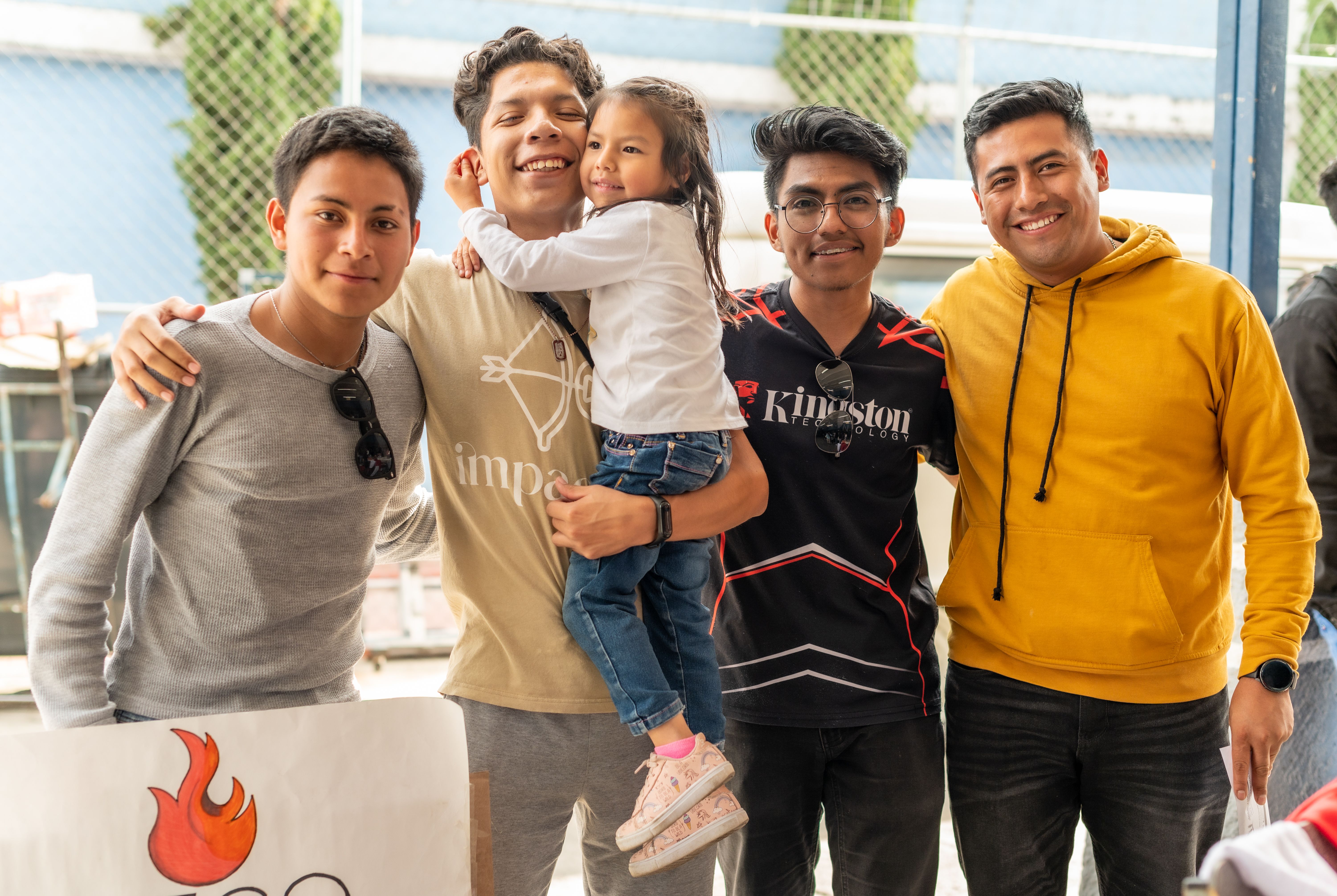 A group of men and a child pose for a photo · Free Stock Photo