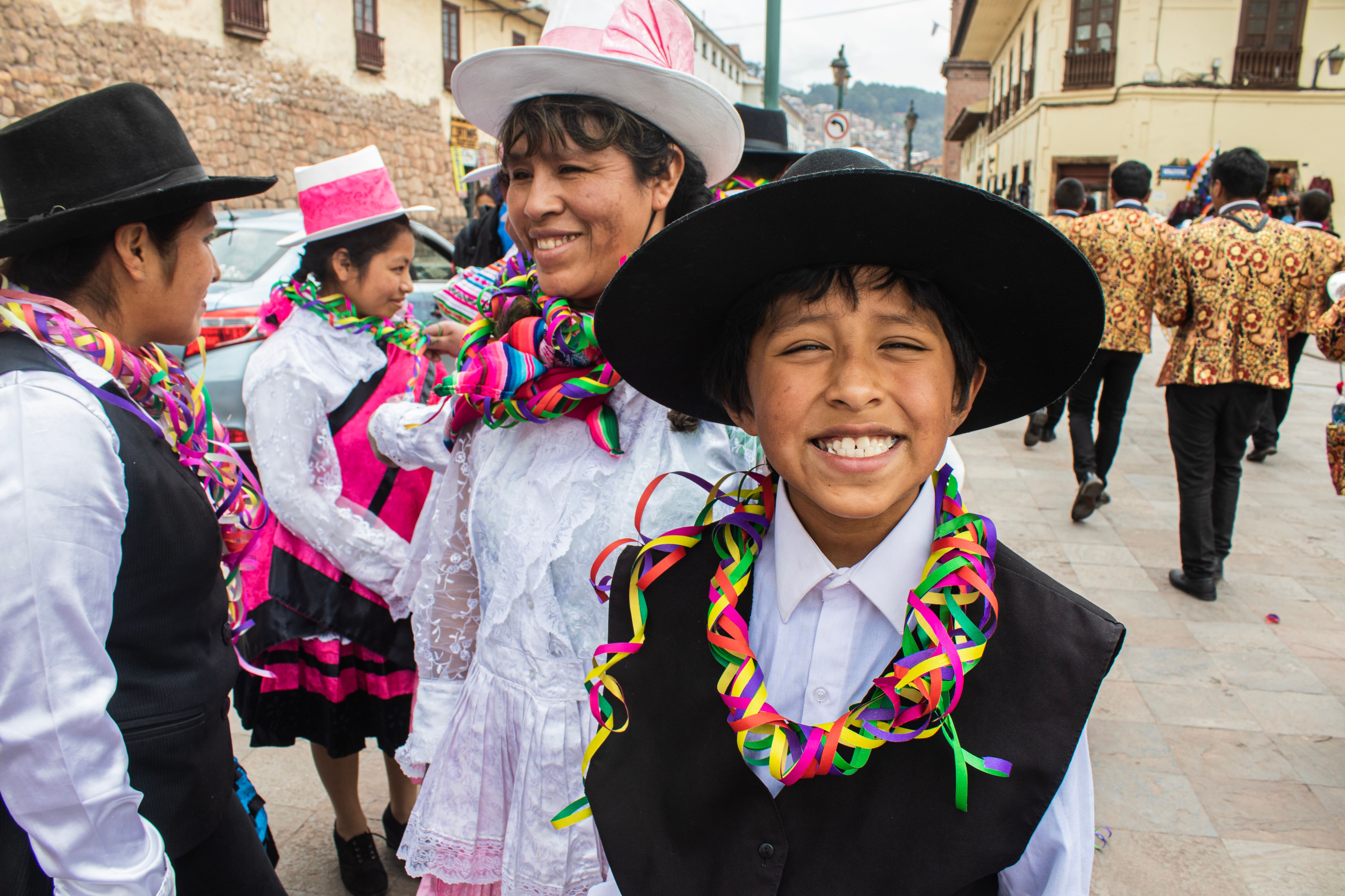Group of People in Traditional Clothing Standing on a Street at a ...
