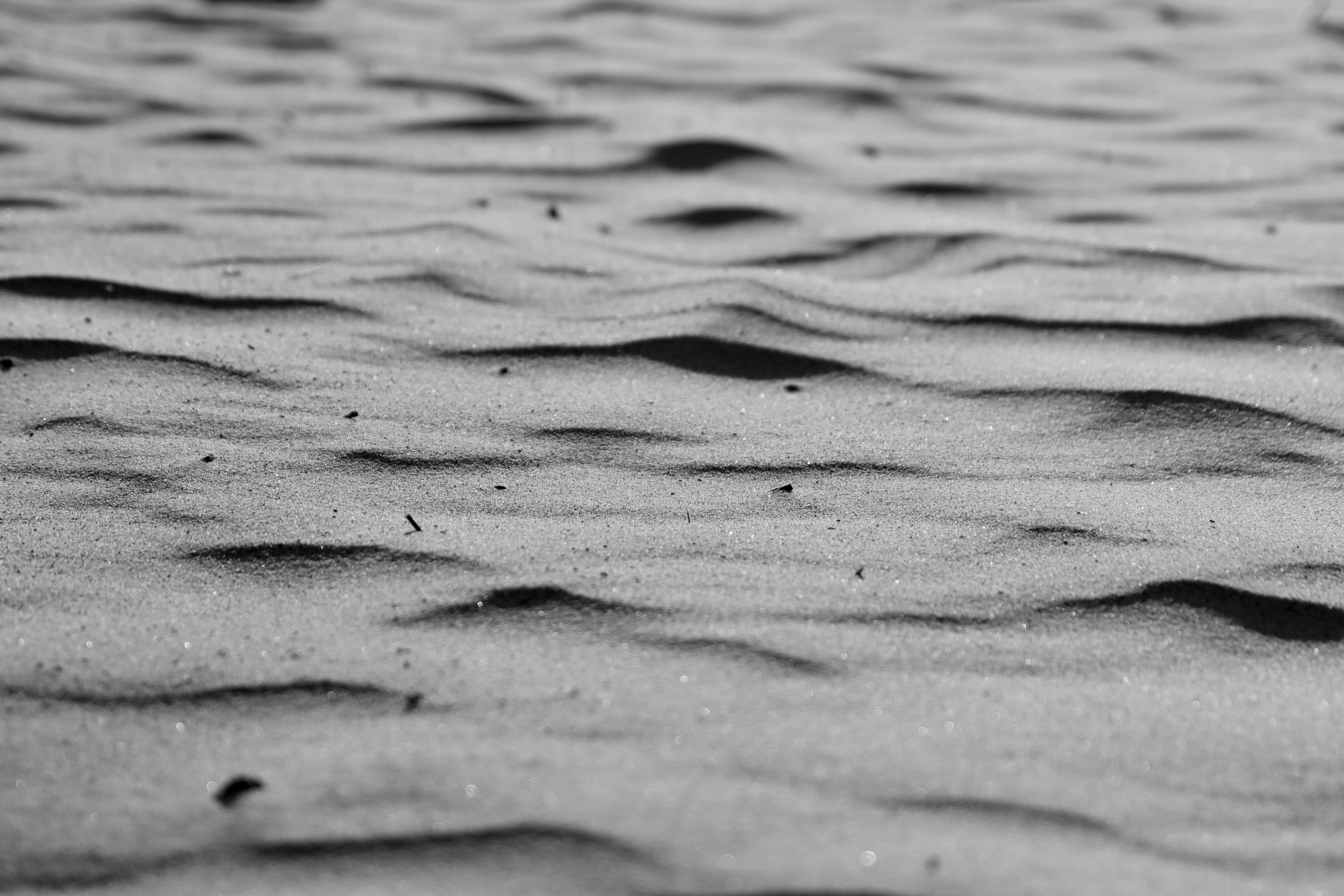 Black and White Close-up of the Sand on a Beach · Free Stock Photo