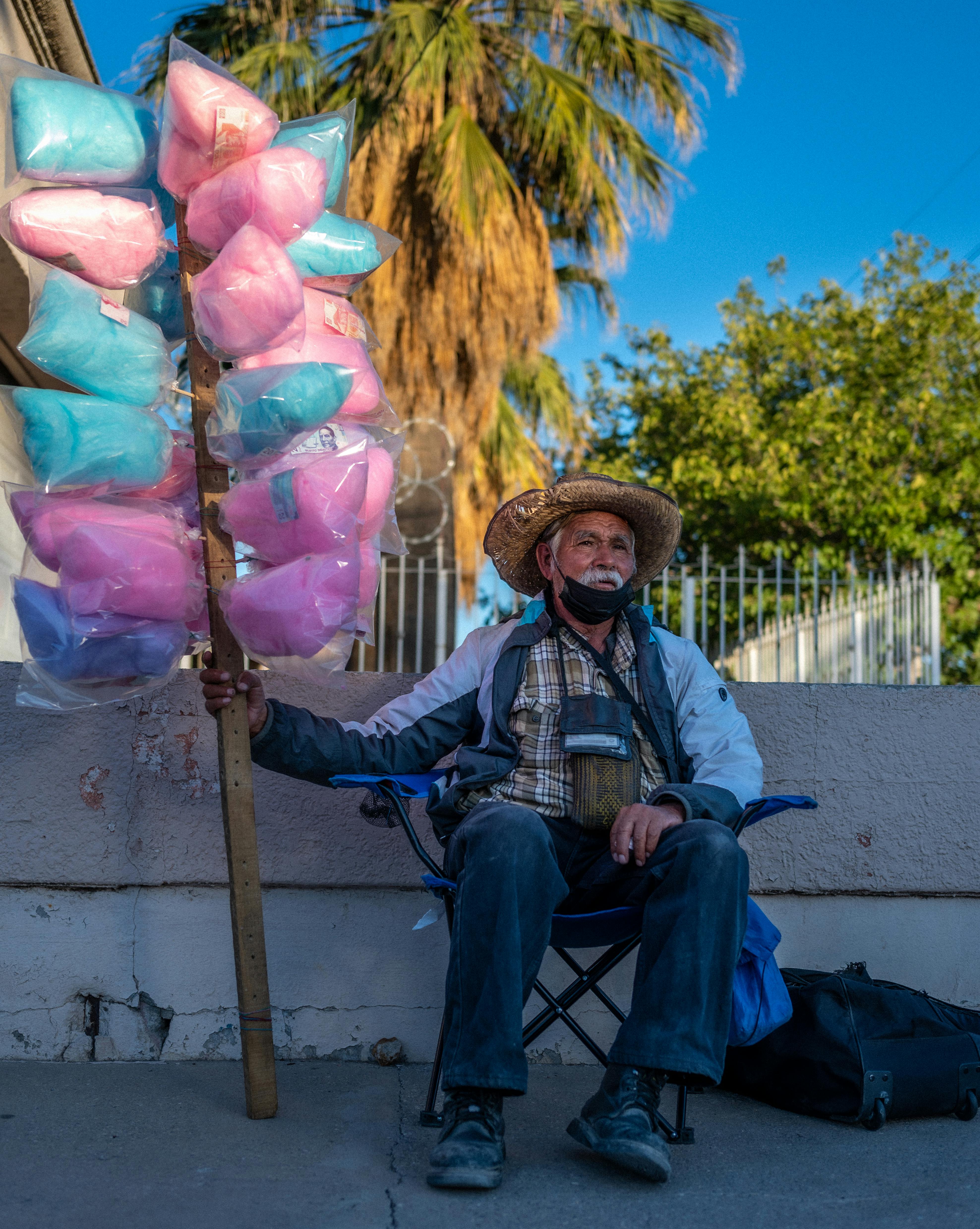 Elderly Cotton Candy Vendor · Free Stock Photo