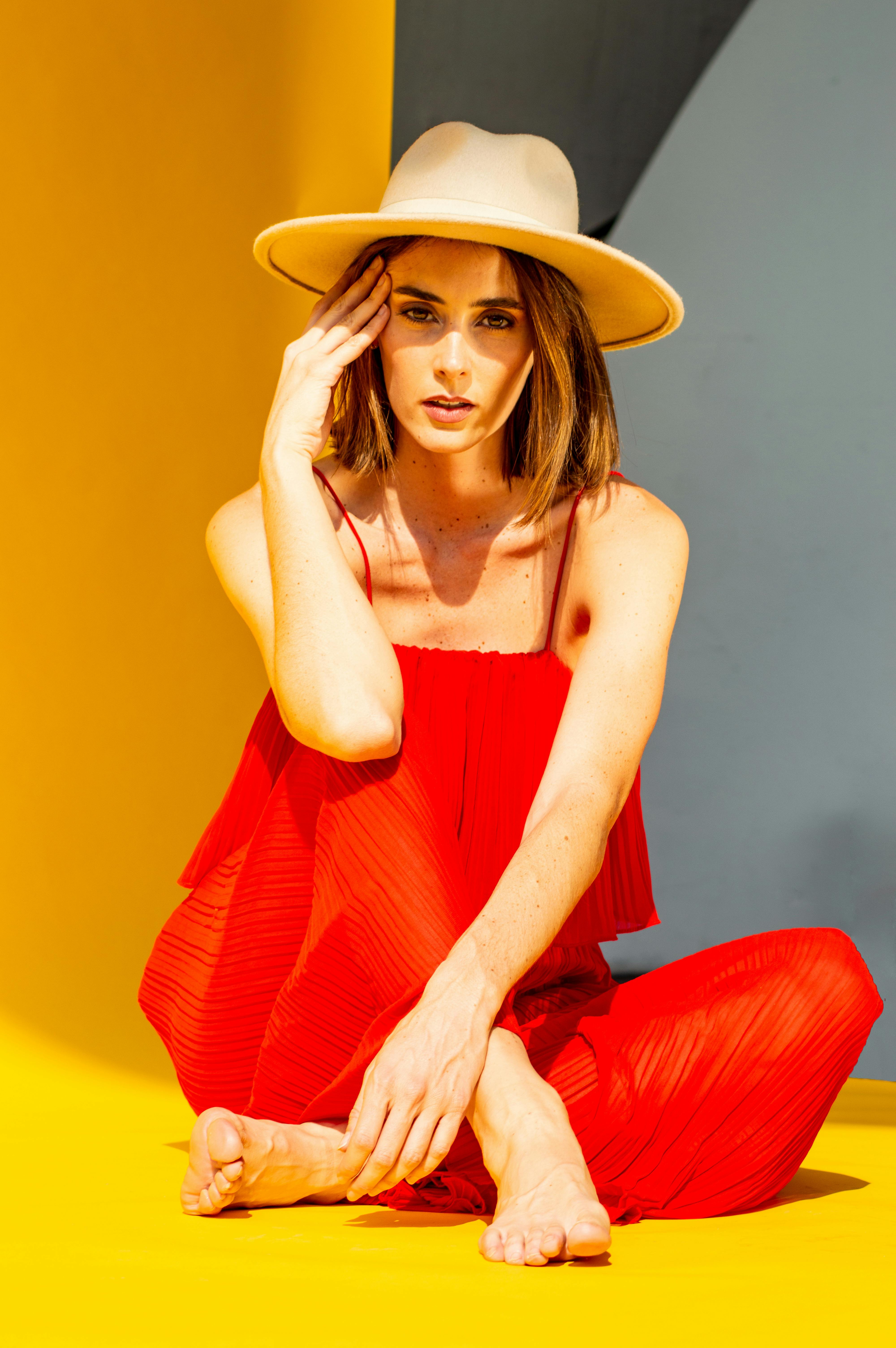 Woman Wearing a Colorful Dress in a Dynamic Pose · Free Stock Photo