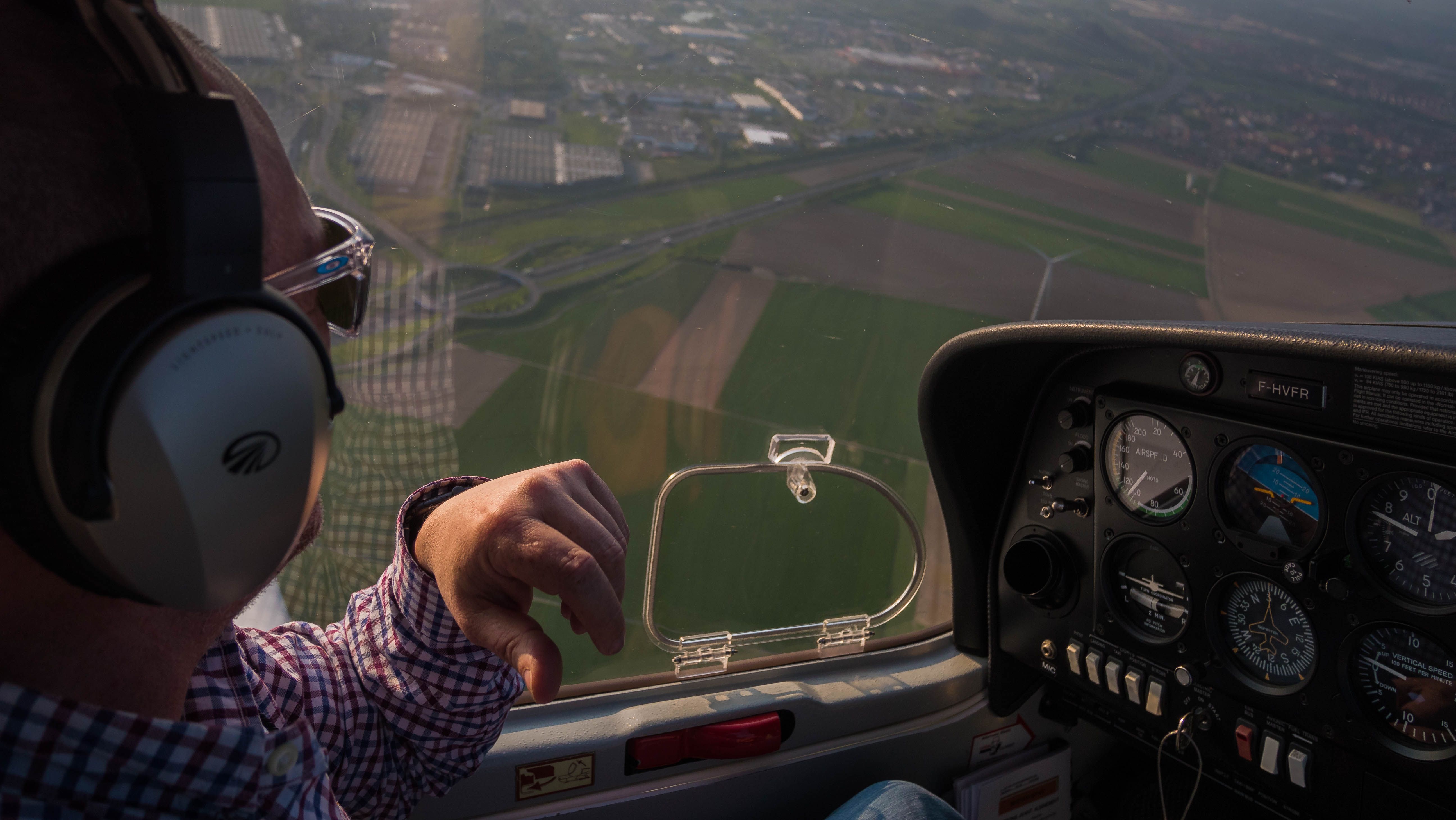 Pilot in Cockpit of Flying Airplane · Free Stock Photo
