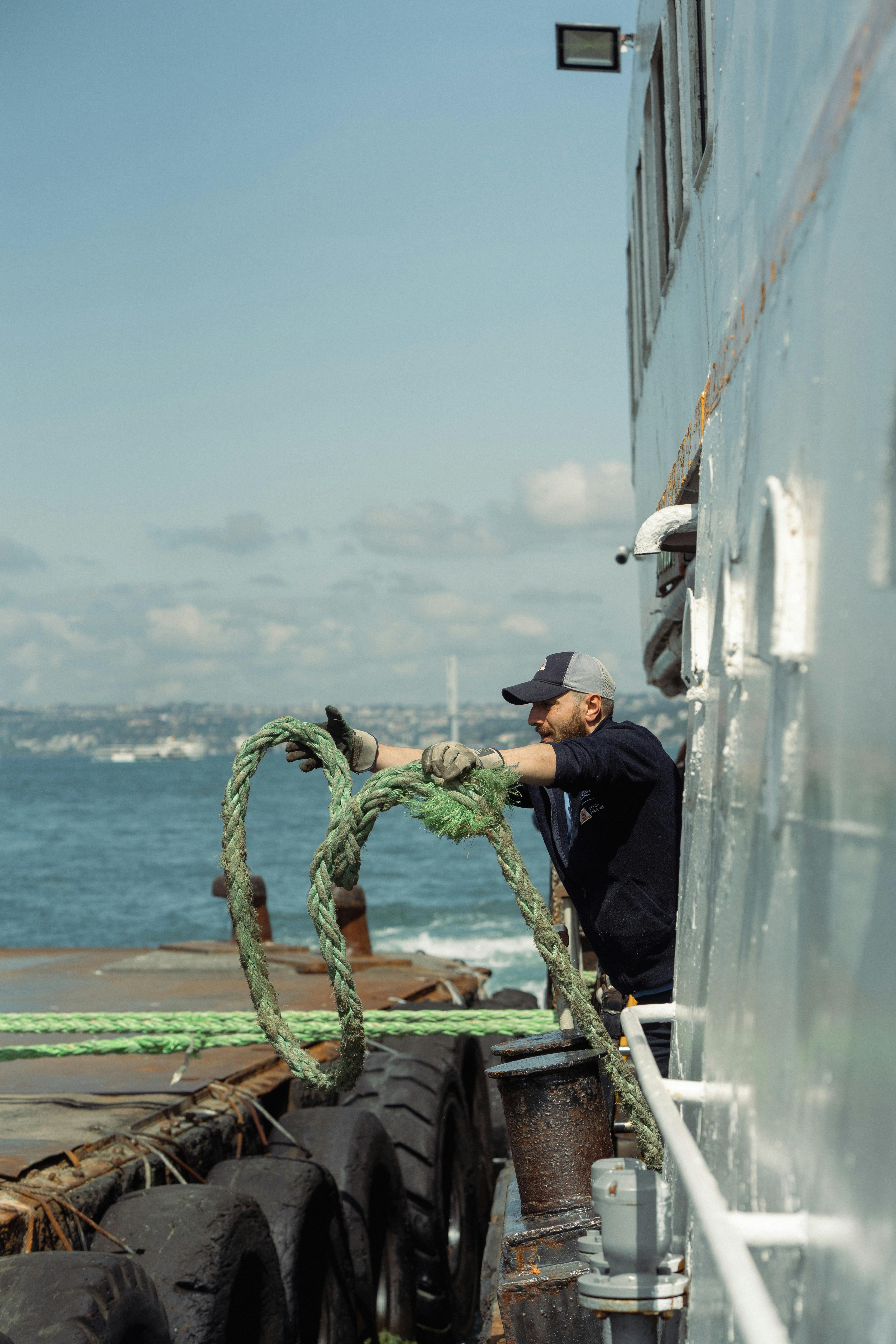 Sailor Mooring Ship on Pier · Free Stock Photo