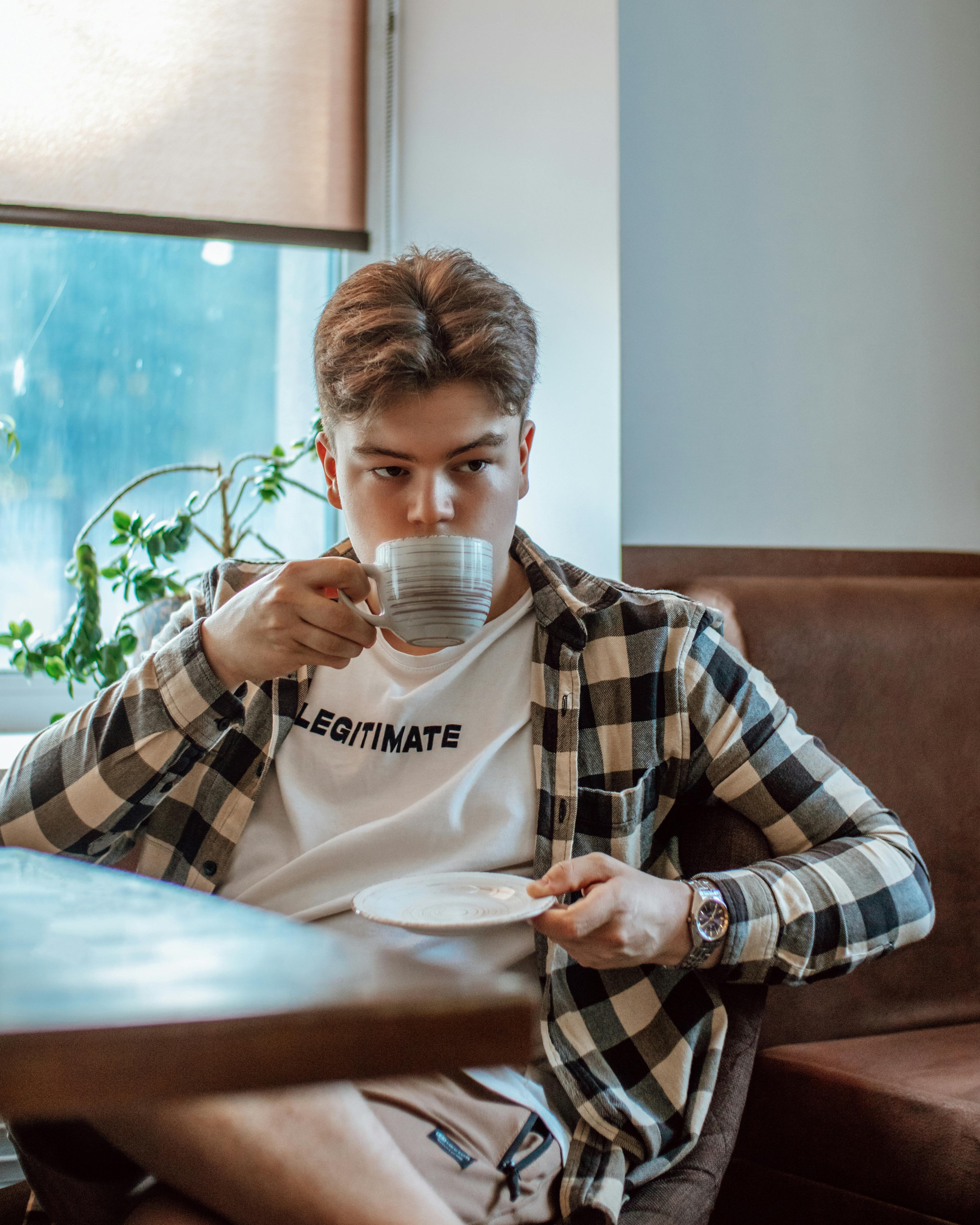 Man Drinking Coffee by Yellow Table · Free Stock Photo