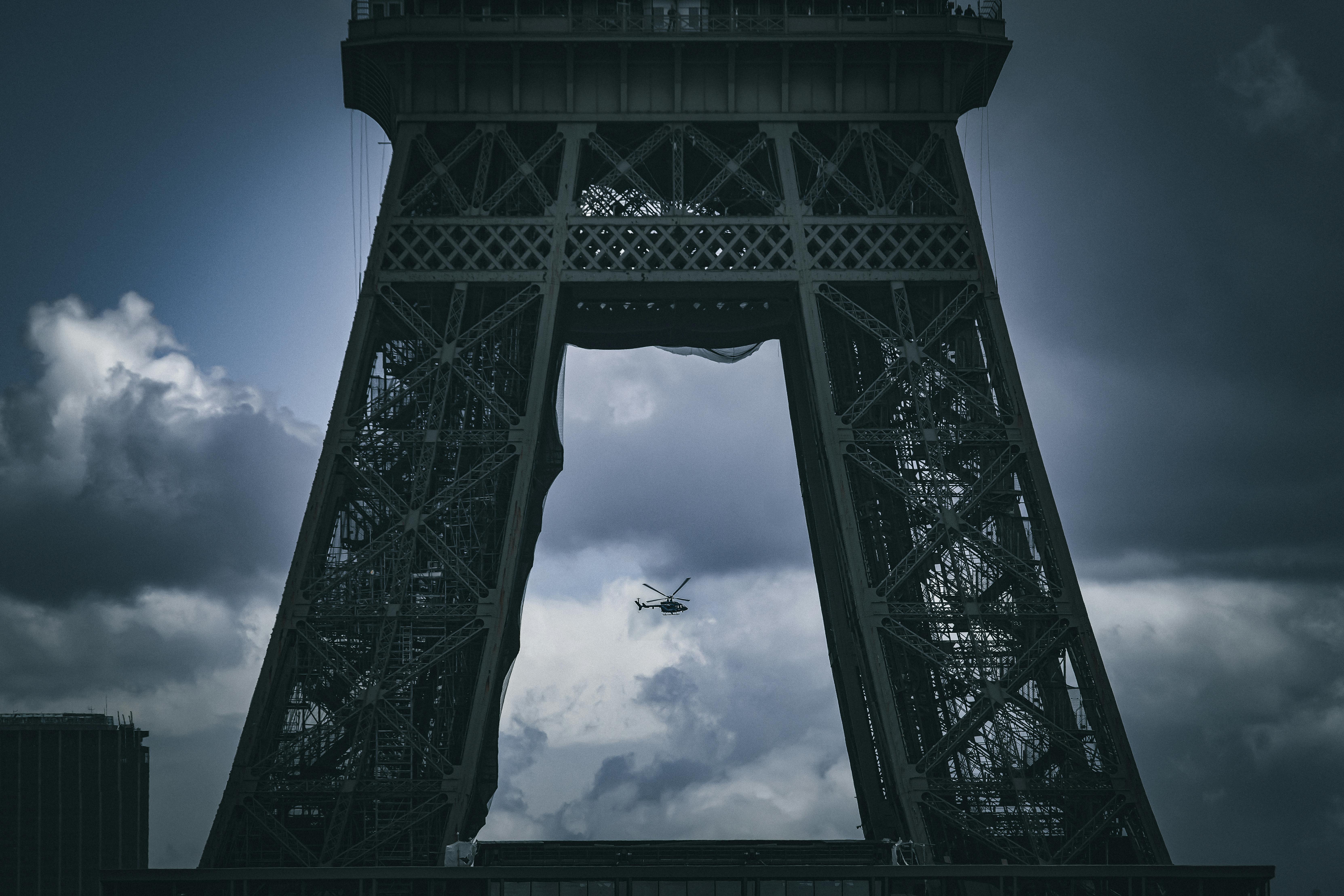 Helicopter behind Eiffel Tower · Free Stock Photo