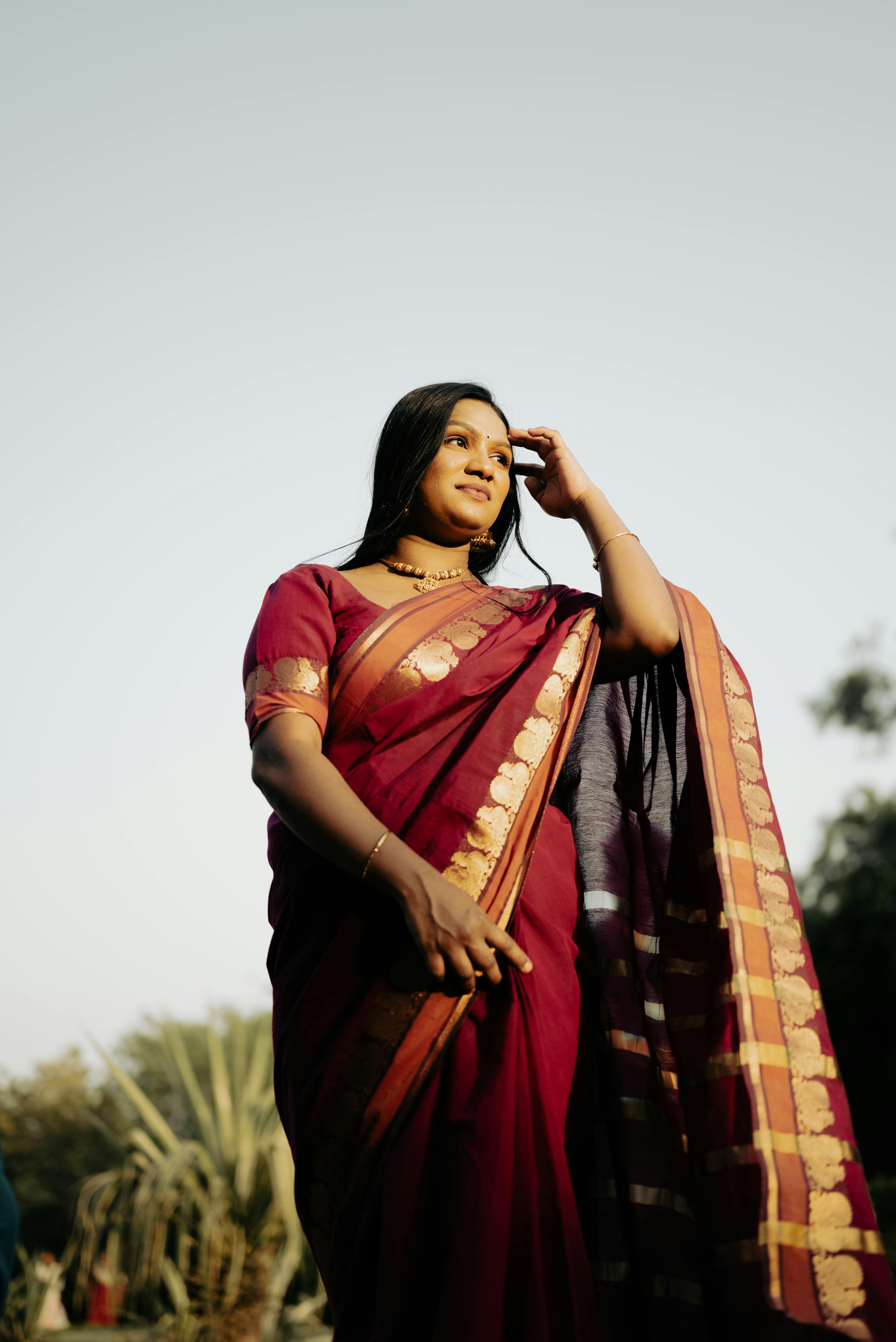 Woman in Red and Gold Sari Wearing a Veil · Free Stock Photo