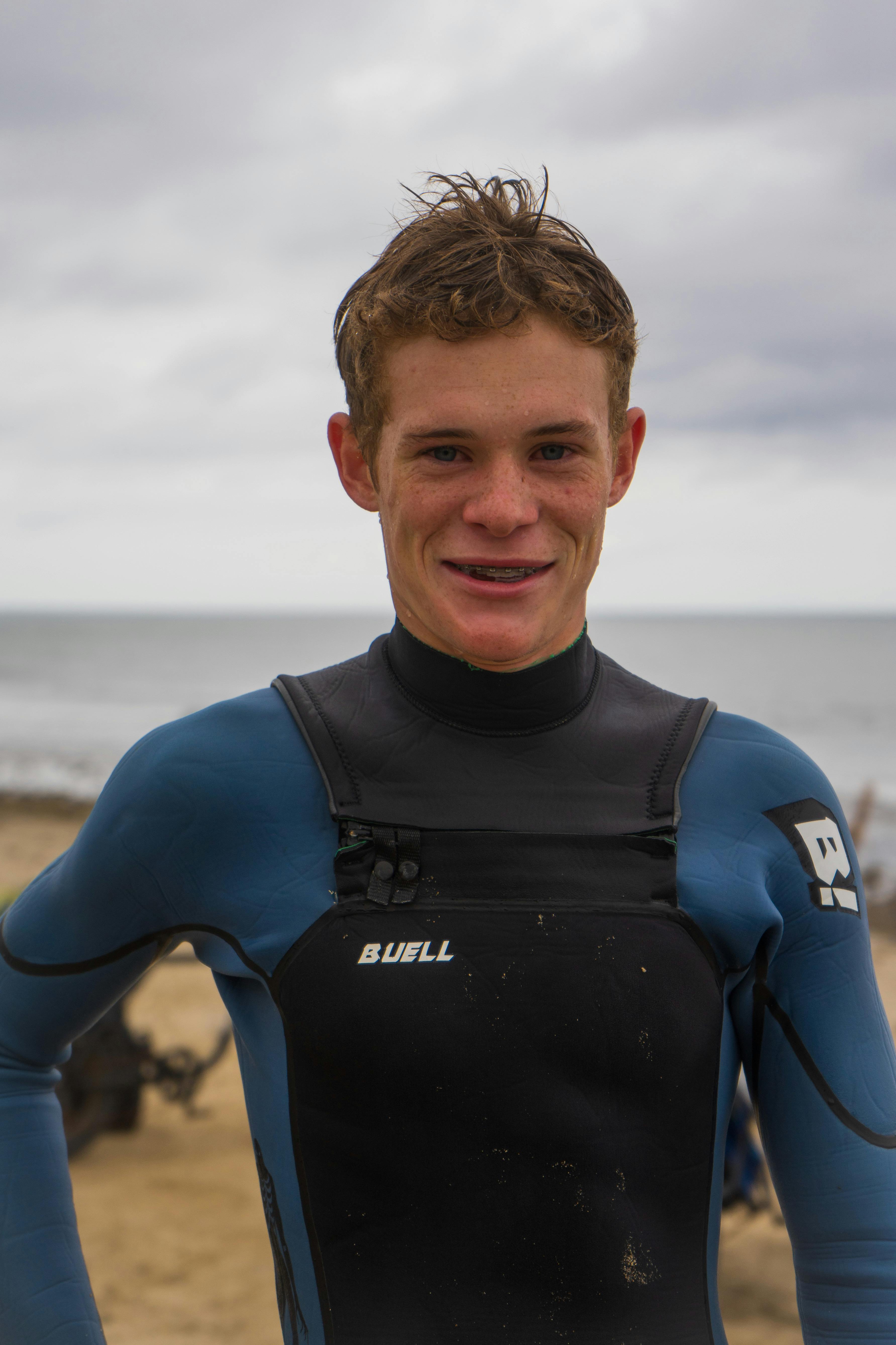 Portrait of Smiling Man in Diving Suit on Beach · Free Stock Photo