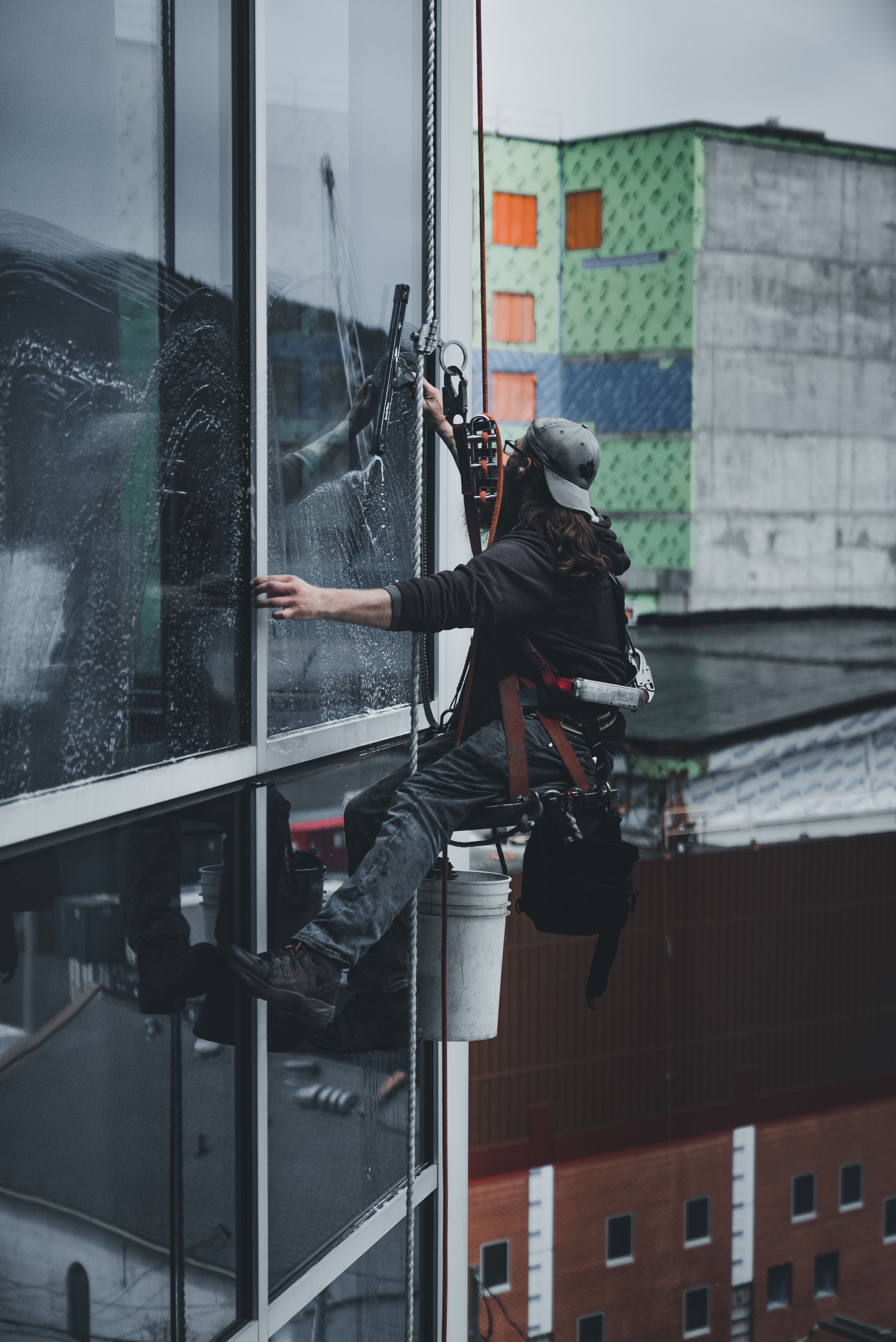 Man during High Rise Window Cleaning · Free Stock Photo