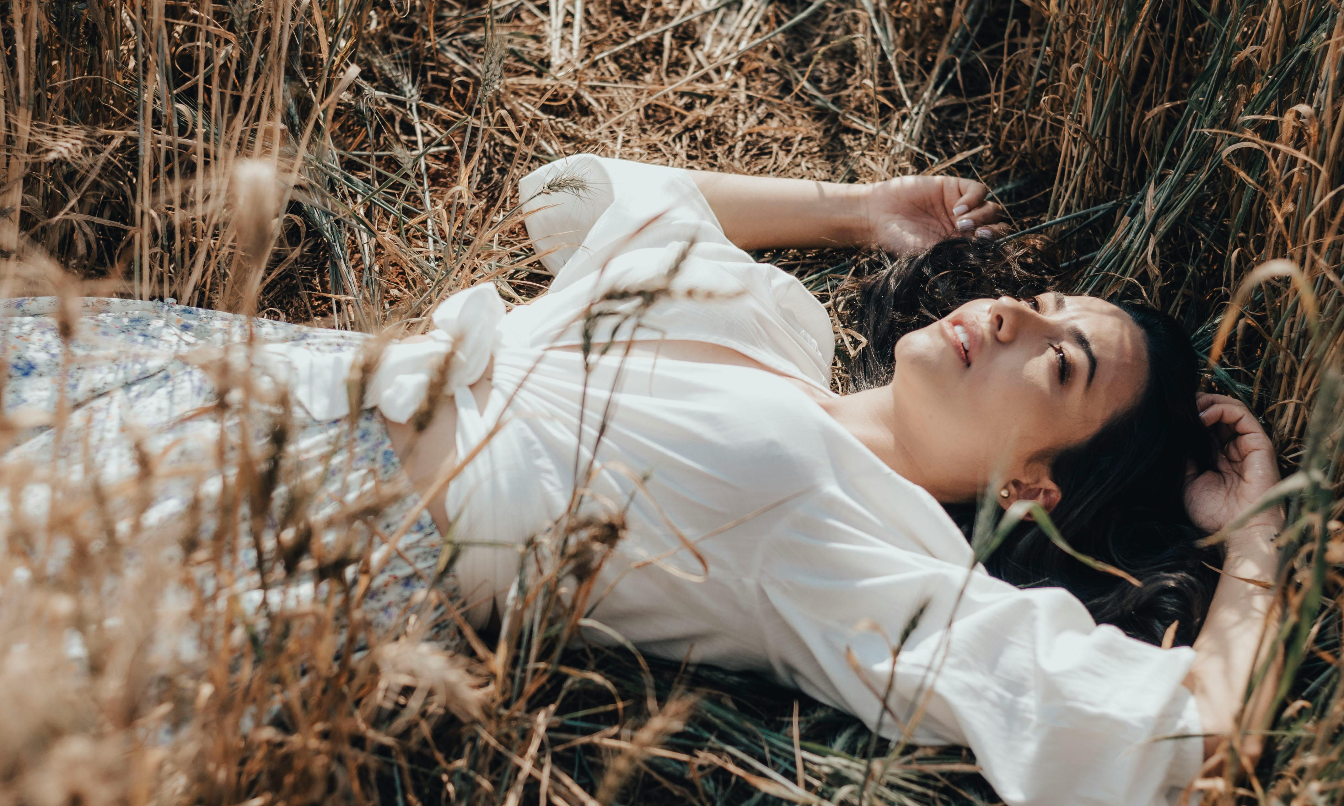 Woman Lying in Field · Free Stock Photo