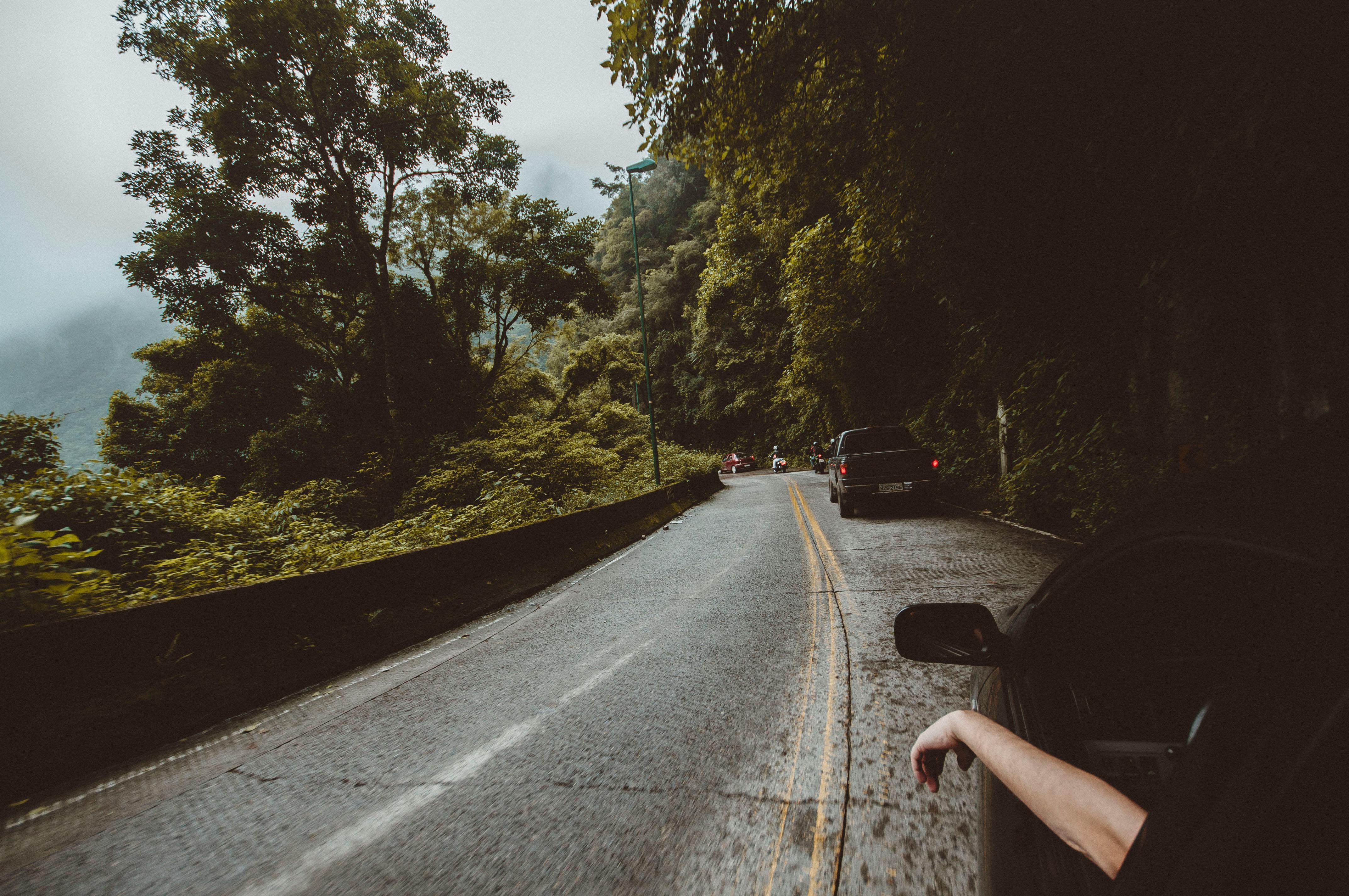 Red Car Travels on the Curved Road · Free Stock Photo