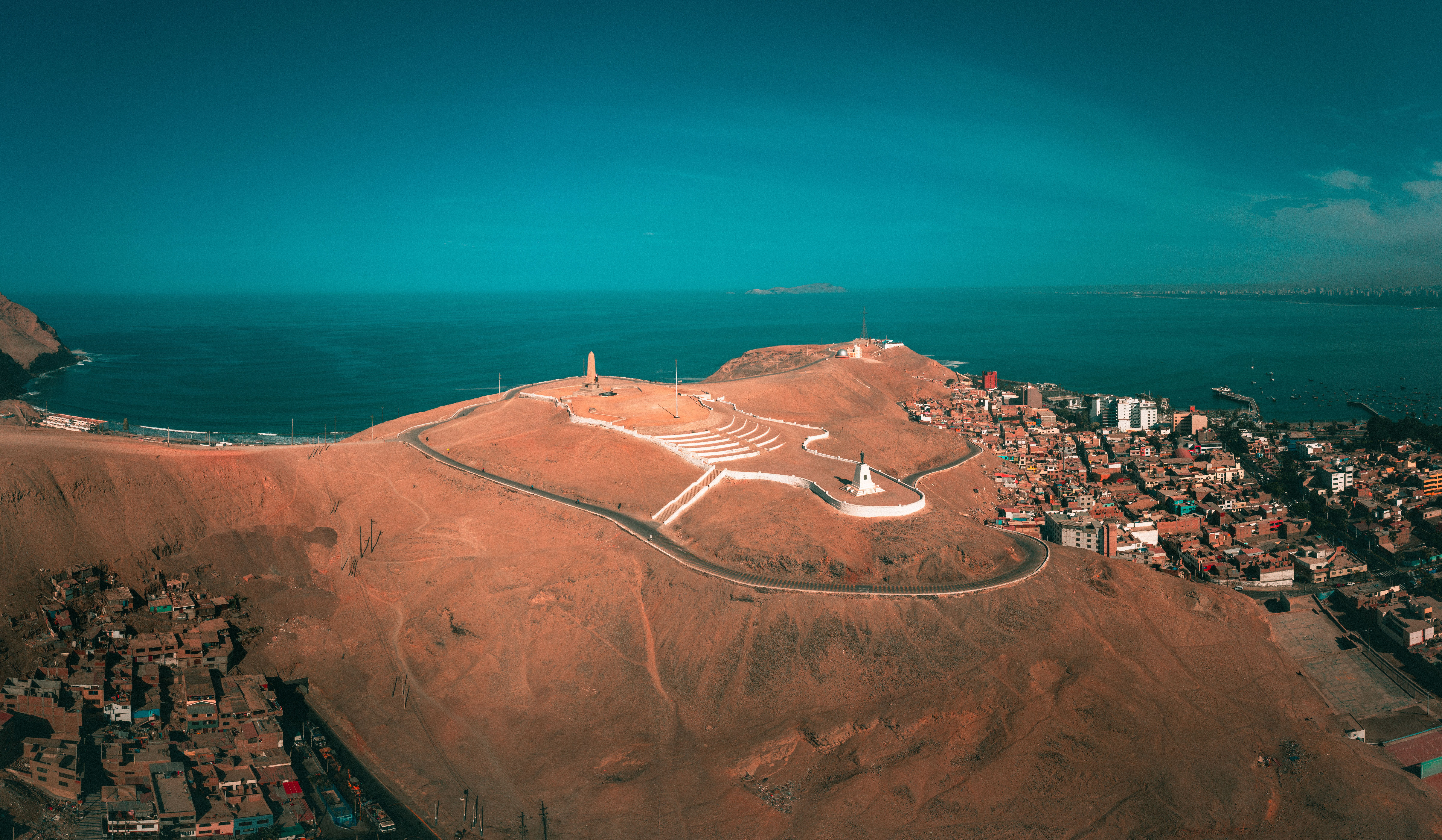 Aerial View of a Large Hill on the Coast and Buildings in a Coastal ...