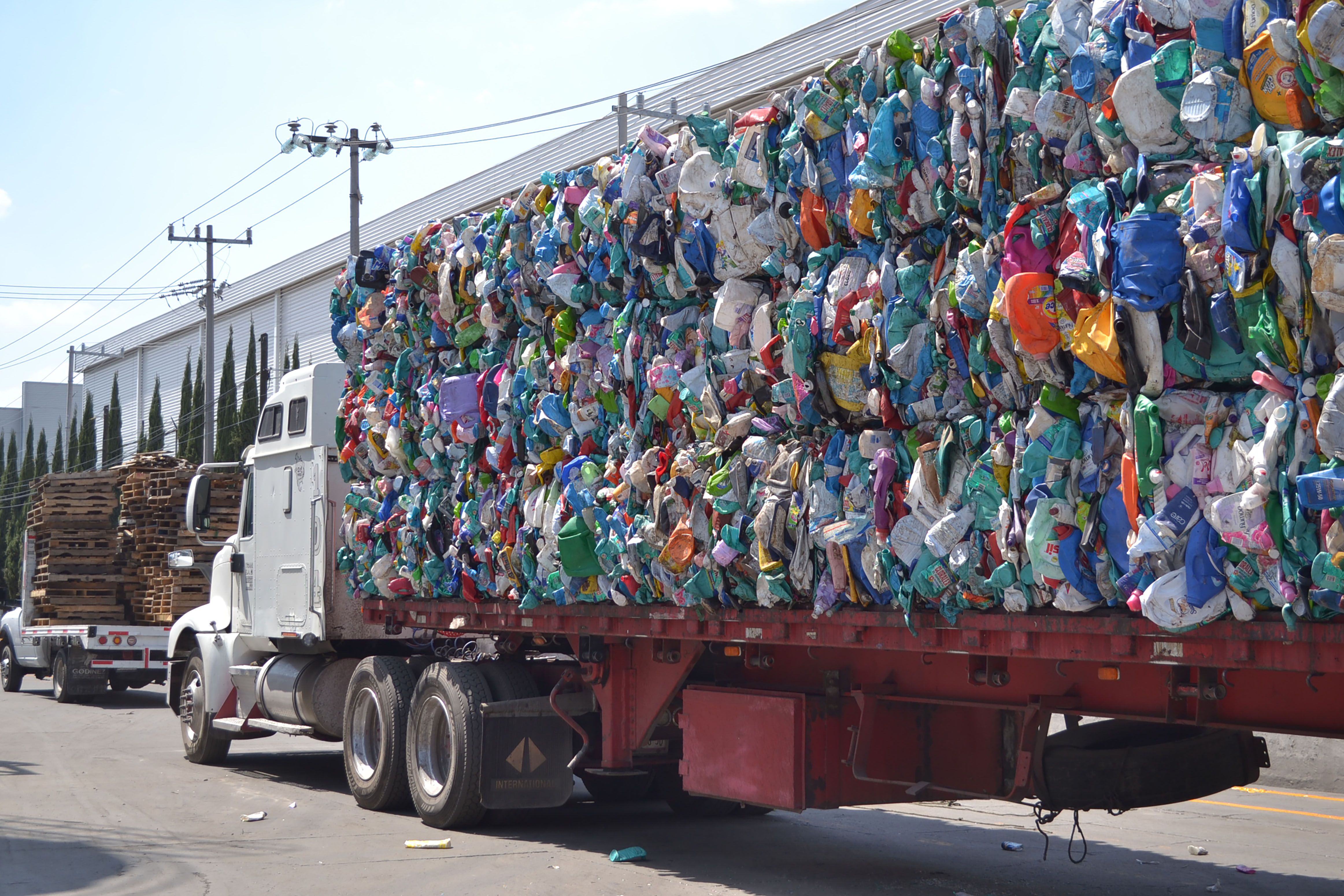 A Truck Loaded with Plastic Trash Driving on a Street in City · Free ...