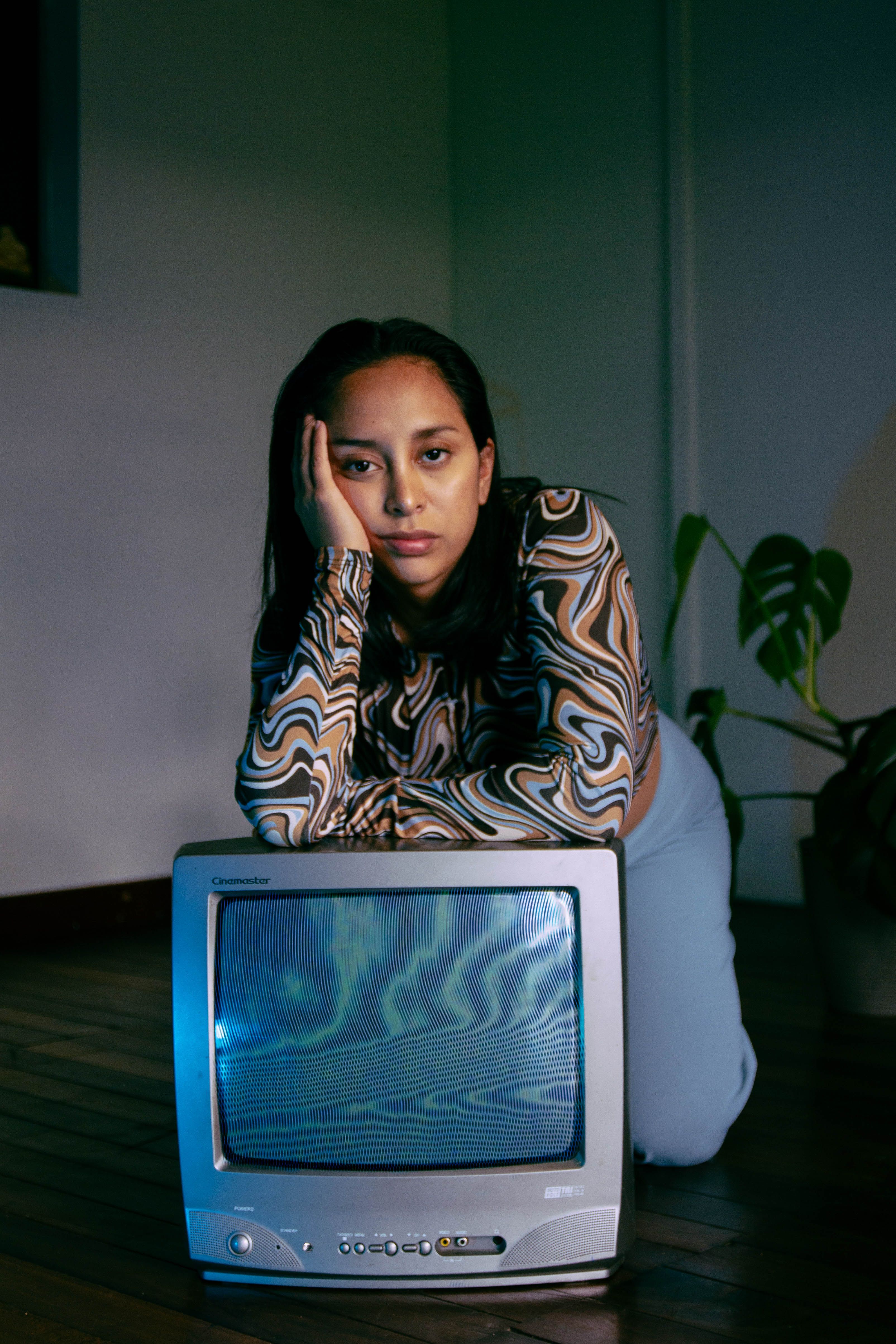 Woman Leaning on Television · Free Stock Photo