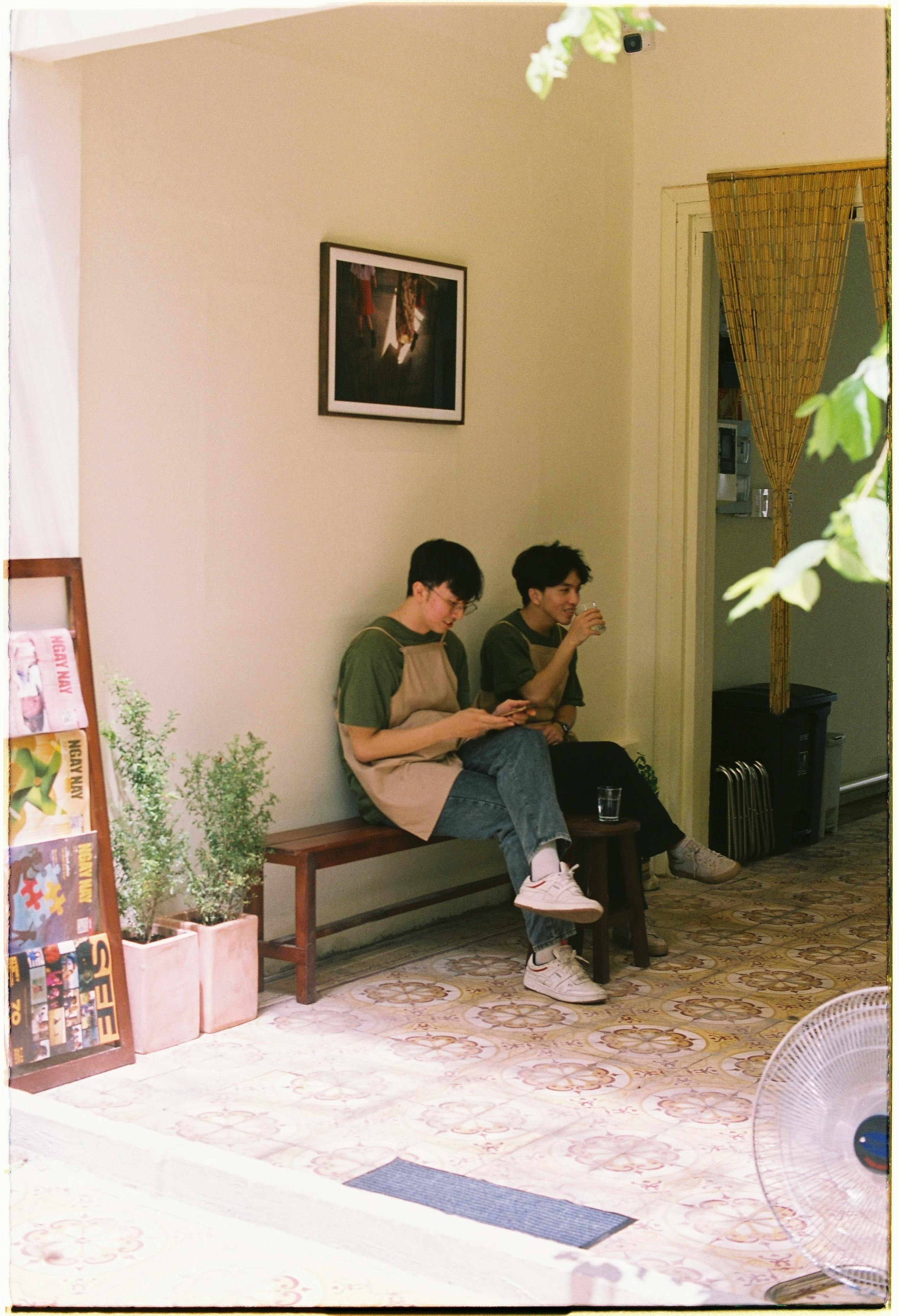 Two Young Baristas Sitting on a Bench during the Break at Work · Free ...