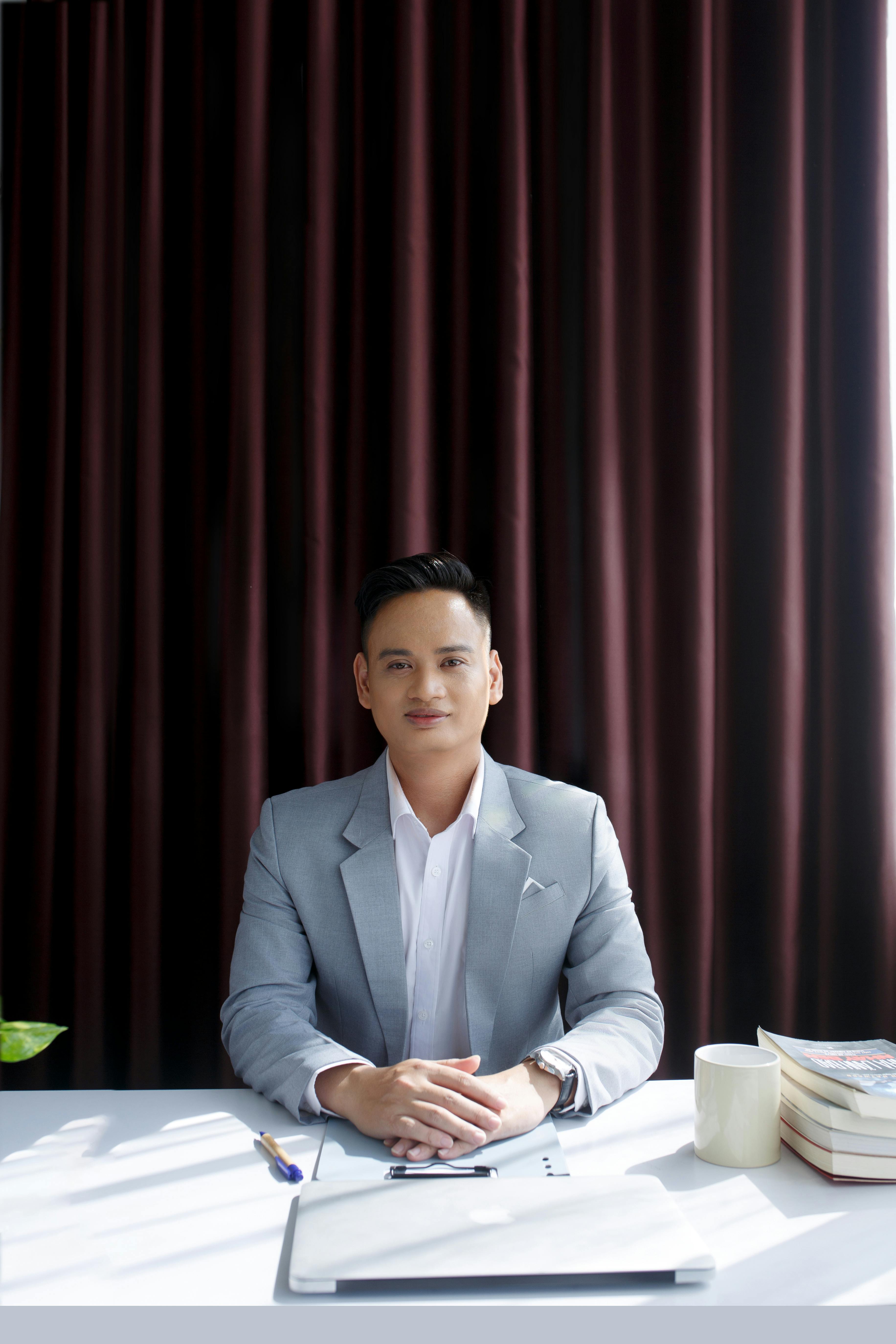 Man Sitting behind the Desk · Free Stock Photo
